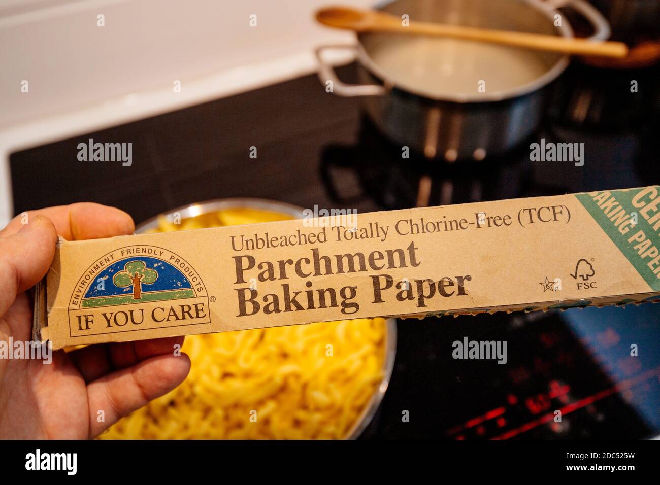 Paris, France - Nov 11, 2020: Pov male hand holding against kitchen background new Parchment ...