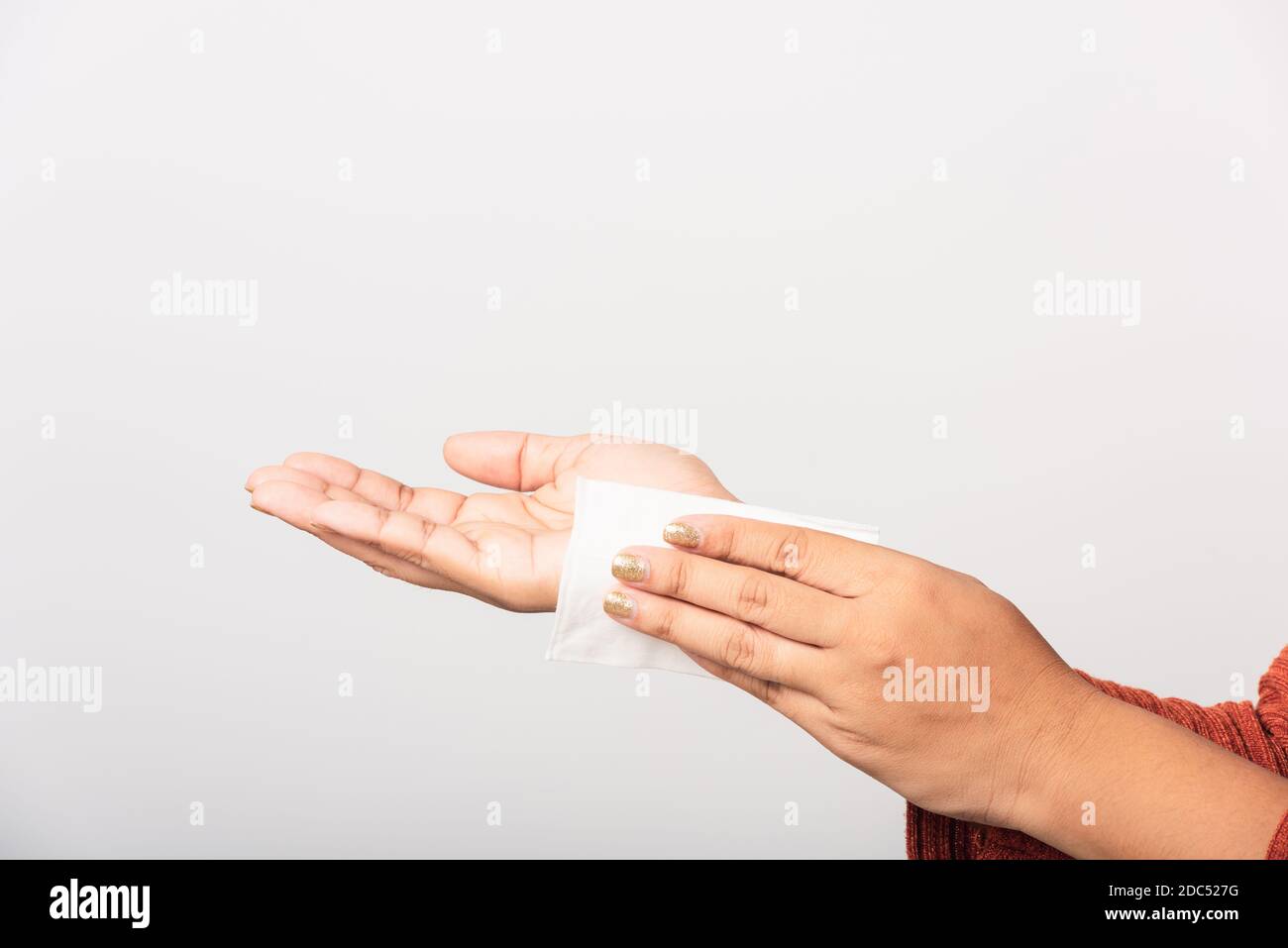 Close up hand of Asian woman she using wet tissue paper wipe cleaning ...