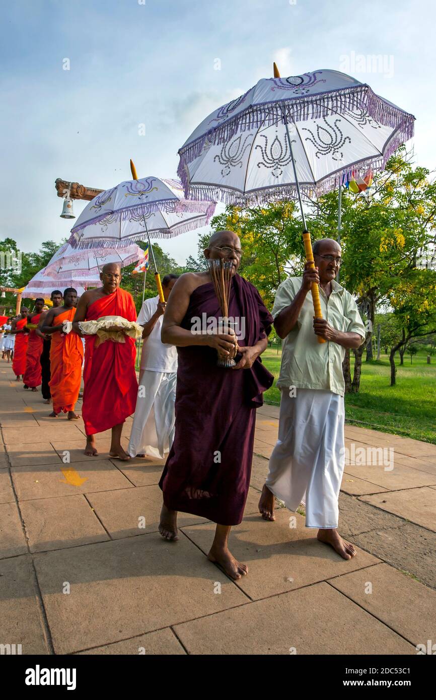 Buddhist monks with umbrellas hi-res stock photography and images - Alamy
