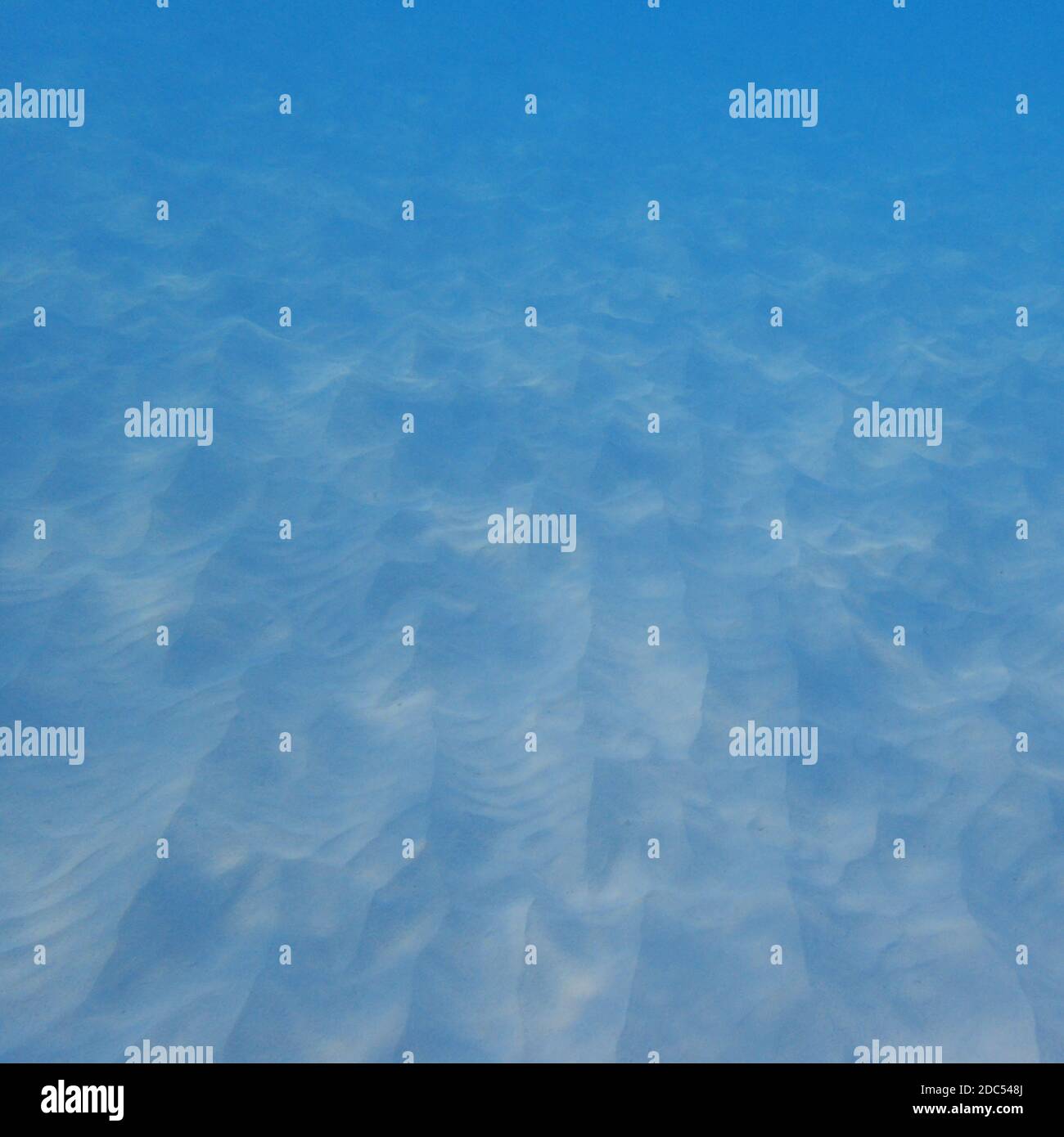 Sand underwater that the waves have formed a pattern that is unique ...