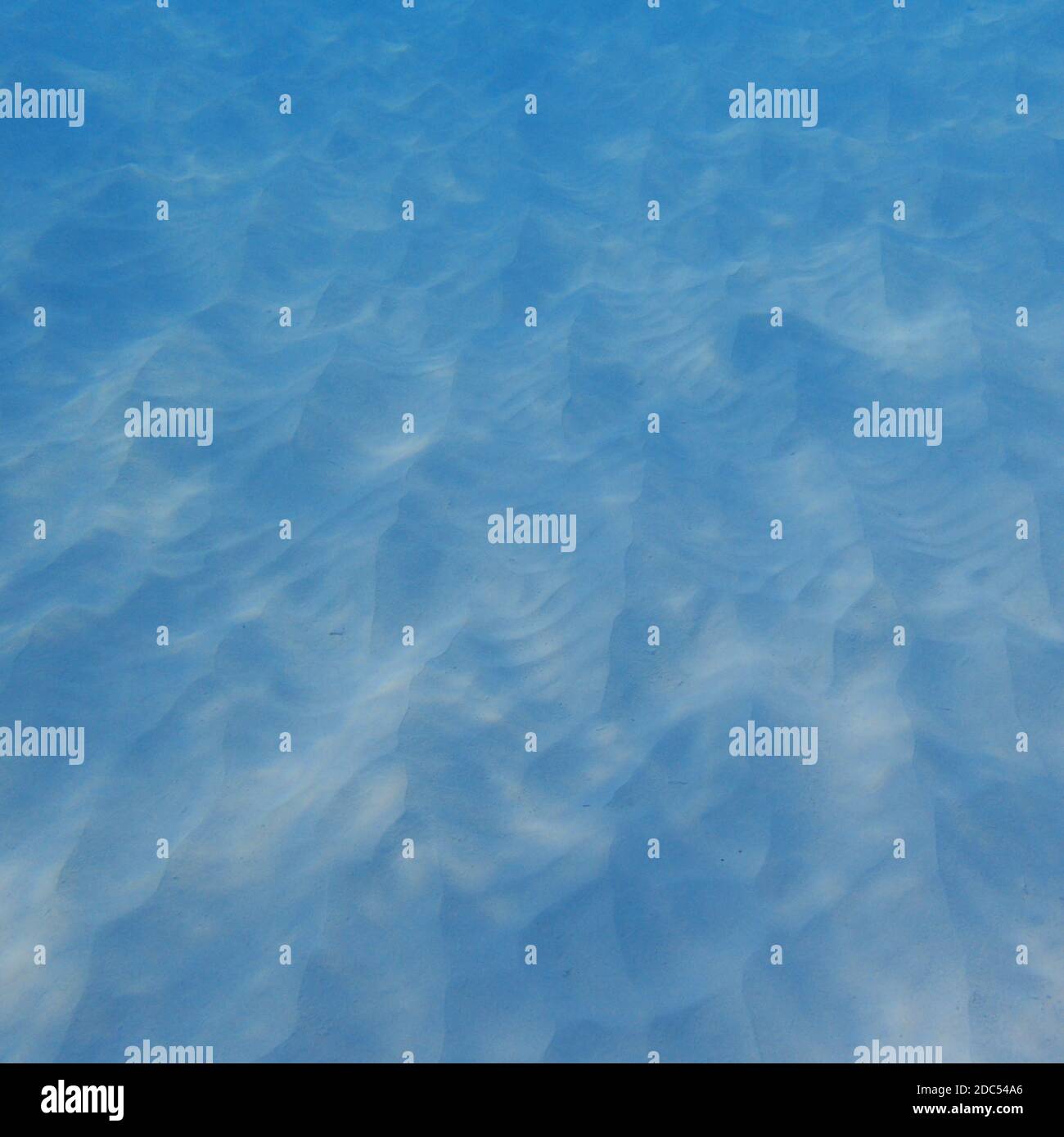Sand underwater that the waves have formed a pattern that is unique ...
