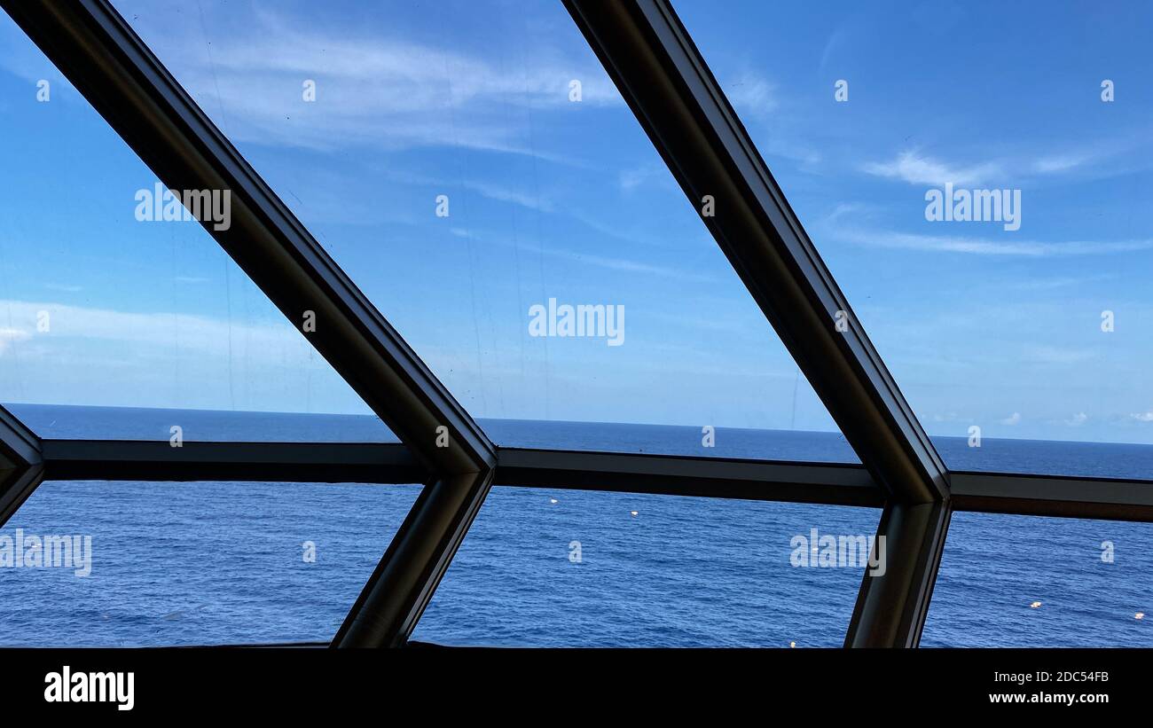 A cruise ship window overlooking the blue Atlantic Ocean Stock Photo ...