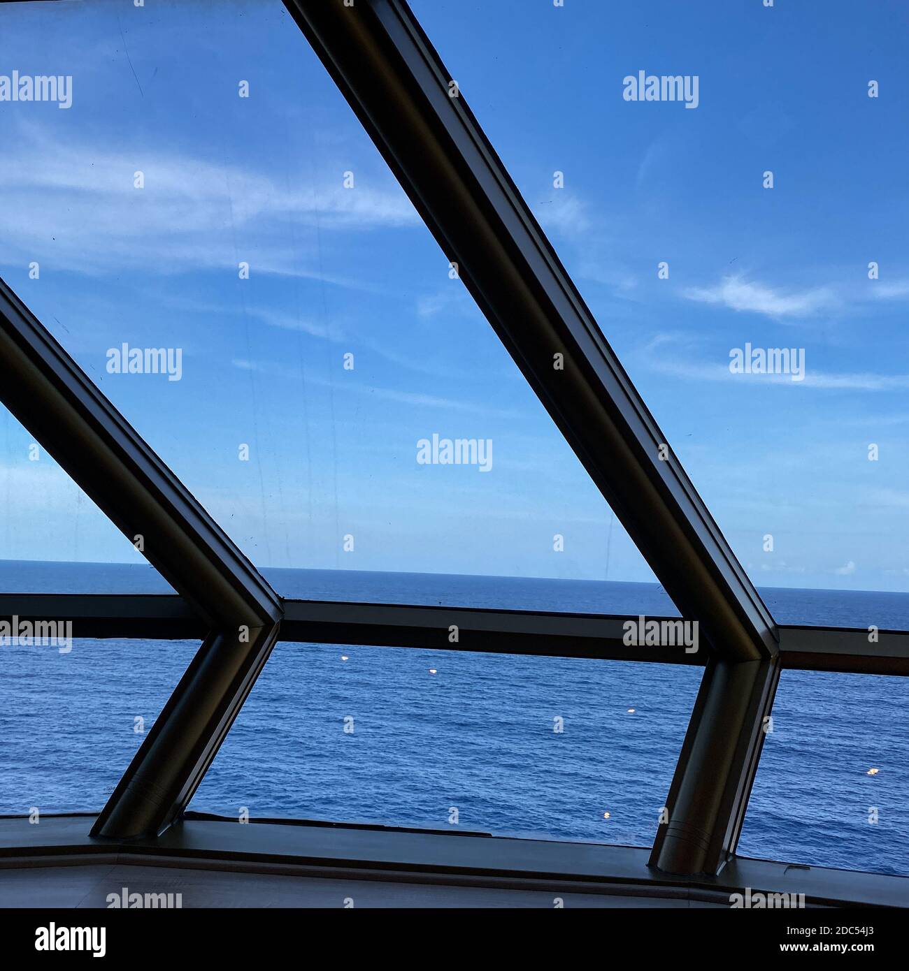 A cruise ship window overlooking the blue Atlantic Ocean Stock Photo ...