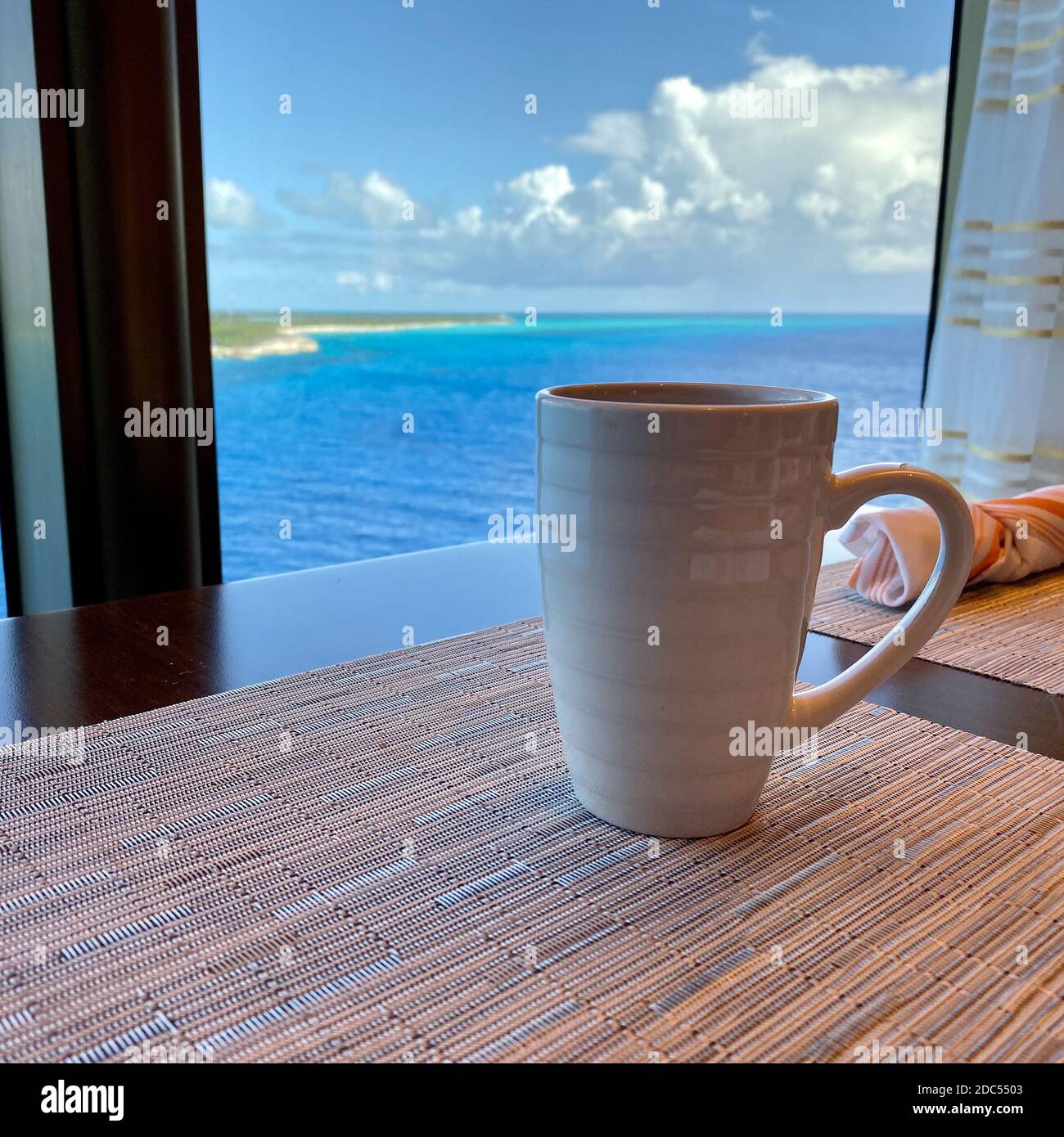 Coffee on a table aboard a cruise ship overlooking the beautiful ...