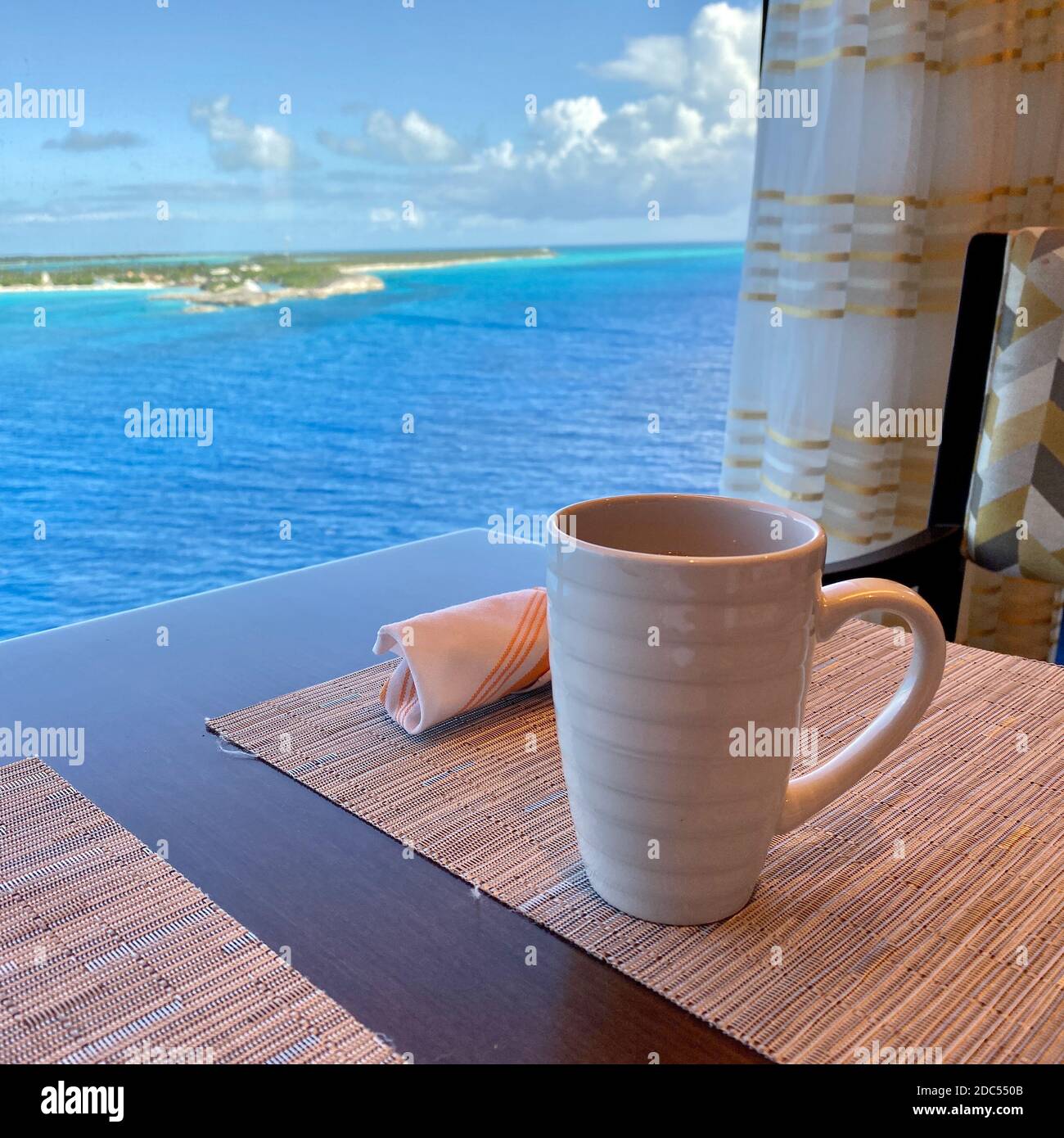 Coffee on a table aboard a cruise ship overlooking the beautiful ...