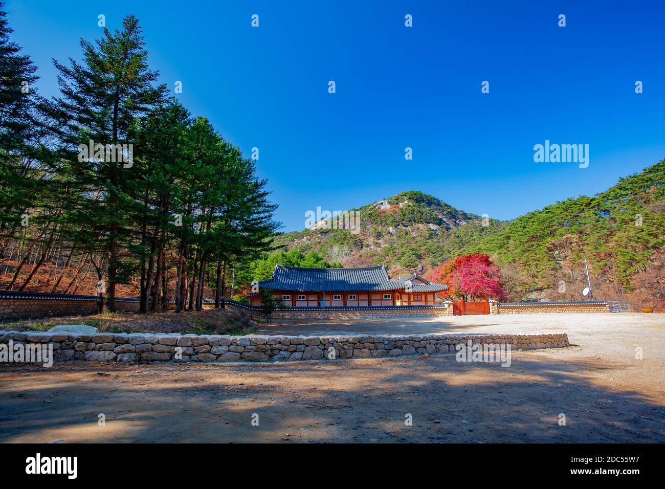 Landscape of Korean traditional buildings, trees, mountains, stones ...