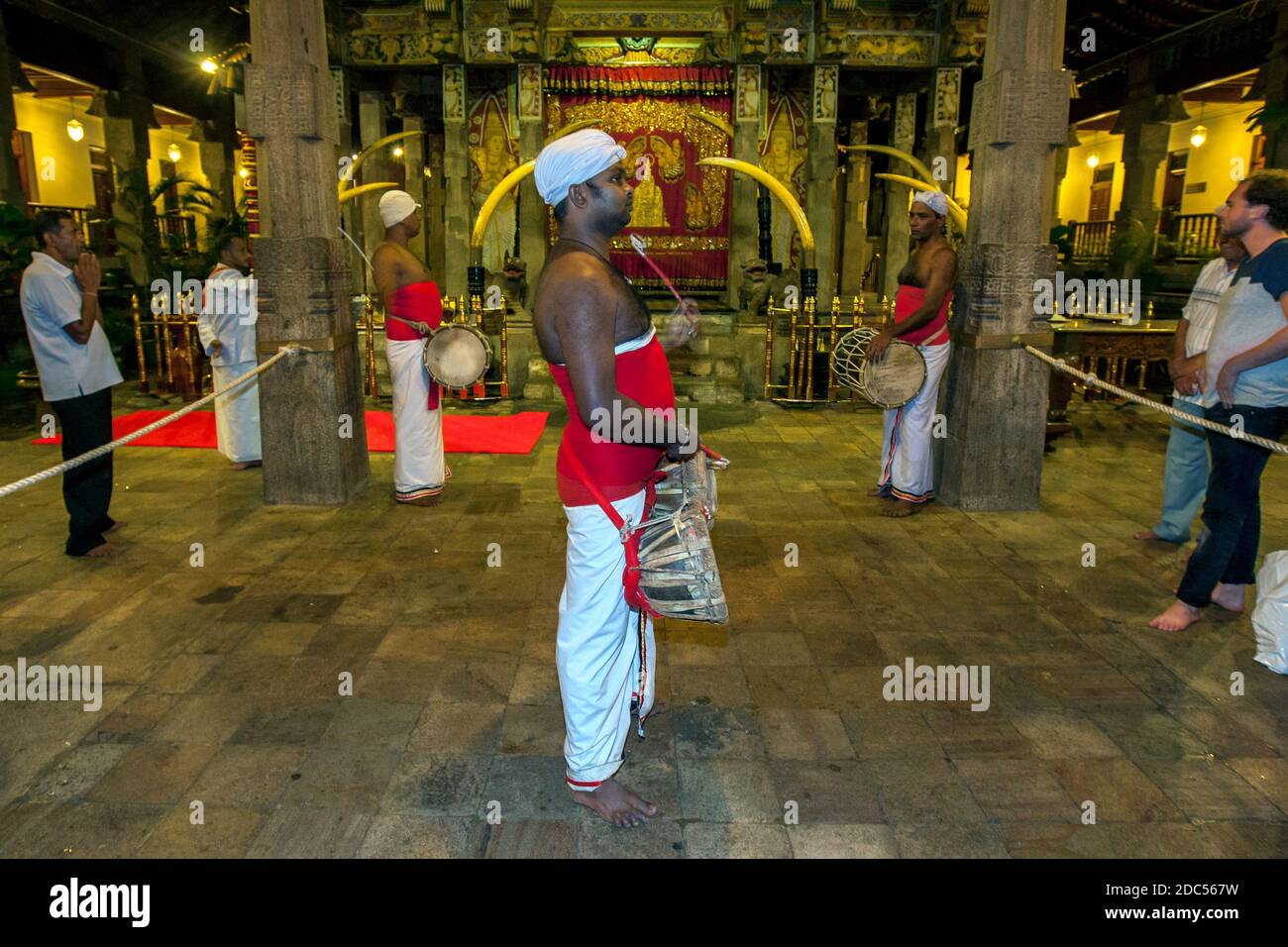 A Buddhist ceremony with Sri Lankan drummers taking place in front of ...