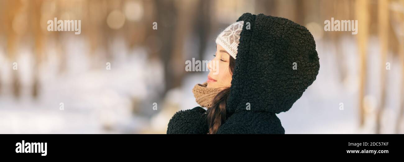 Winter happy woman relaxing breathing cold air outside young people ...