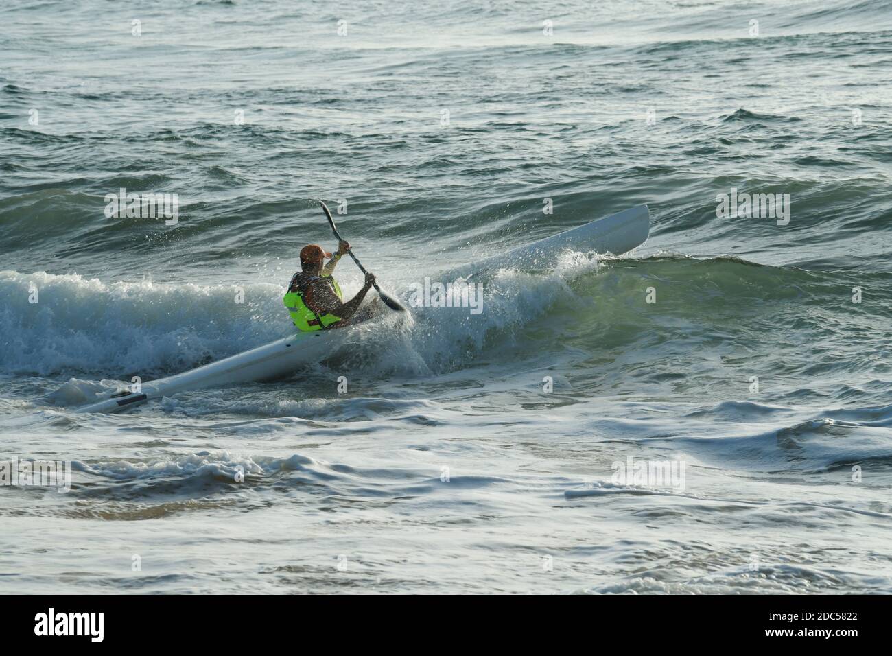 Sport, fit single adult man paddling canoe, seaside activity, Durban ...