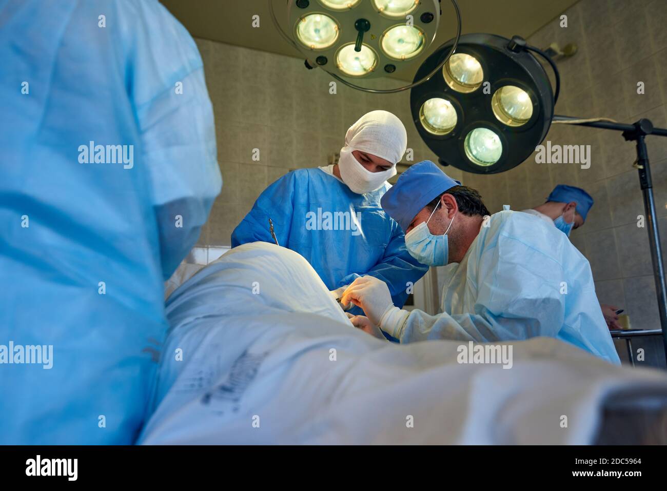 Surgery in progress. Surgeon and his assistant. Medical intervention ...