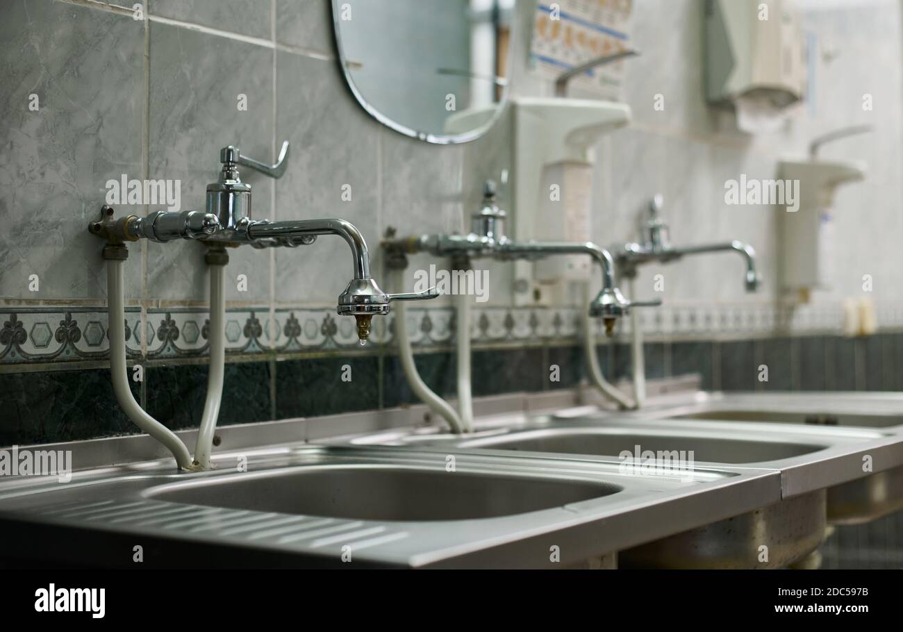 Steel sinks and taps of preoperative room for the treatment of the ...