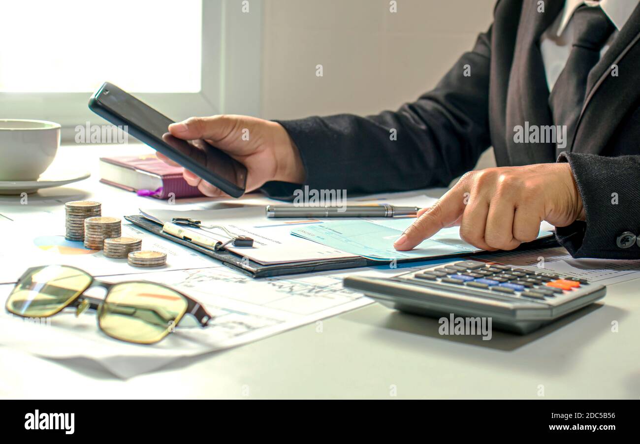 Accountant calculator stack documents hi-res stock photography and ...