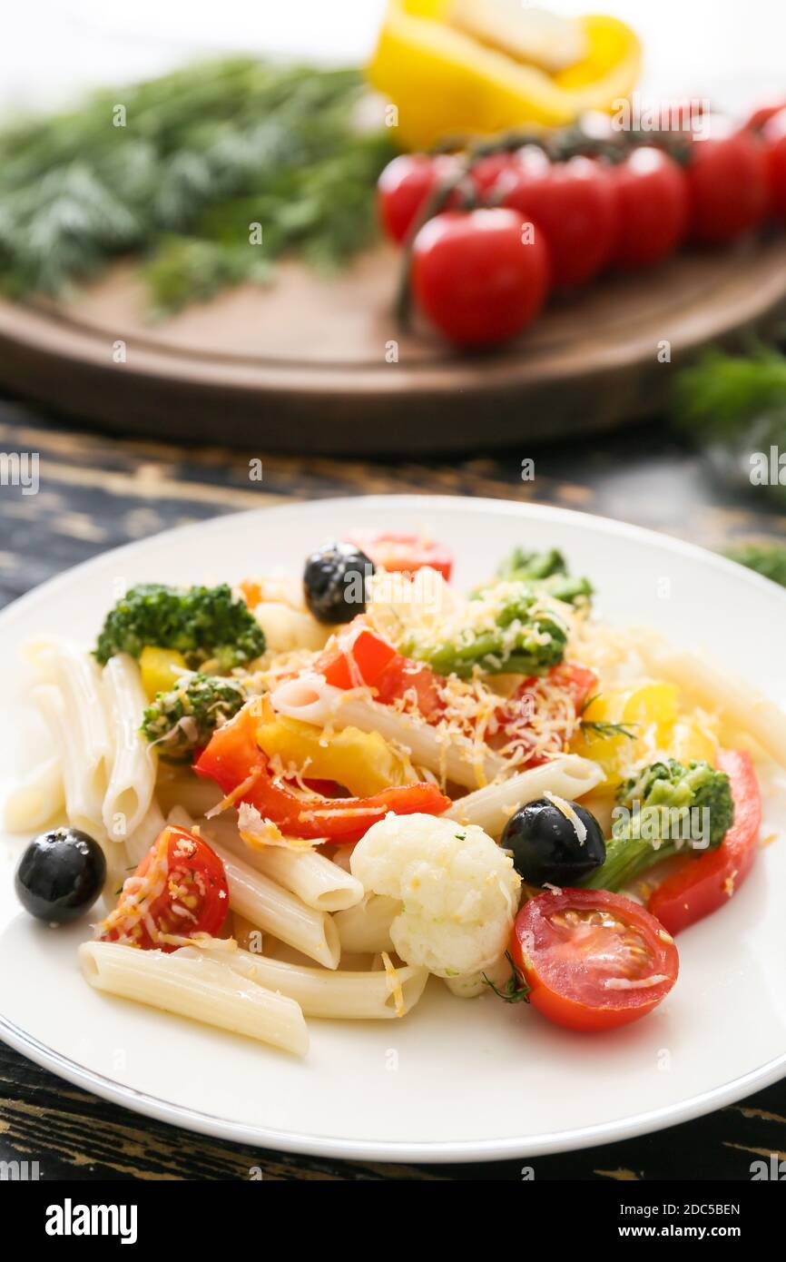 Plate with tasty pasta primavera on table, closeup Stock Photo - Alamy