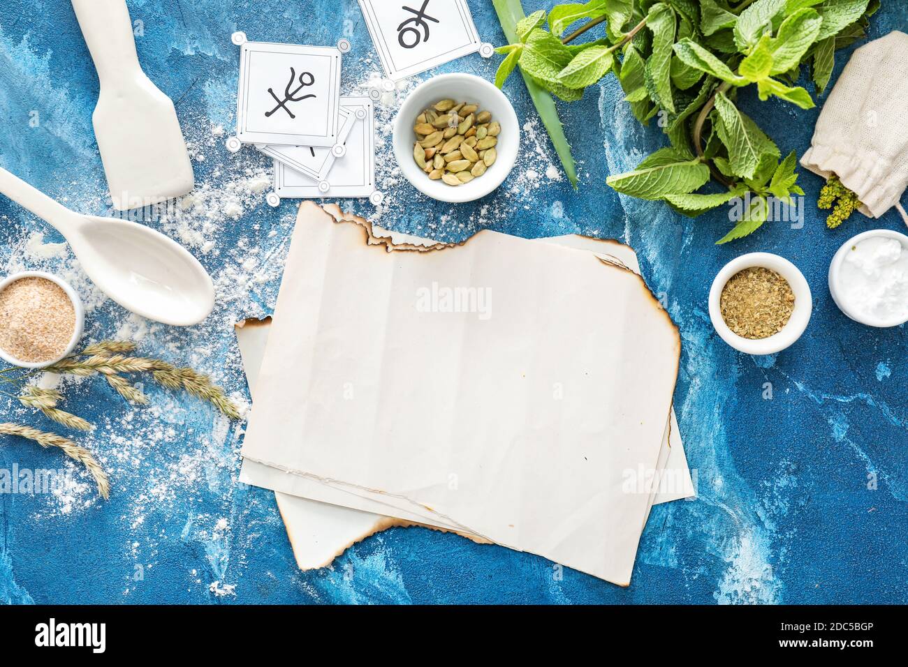 Empty paper sheet and ingredients for preparing potions on color ...