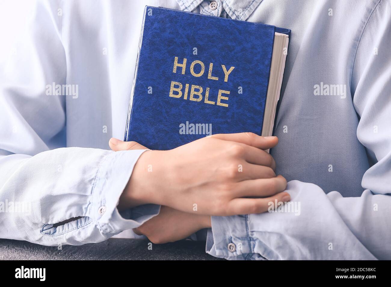 Man holding holy bible hi-res stock photography and images - Alamy