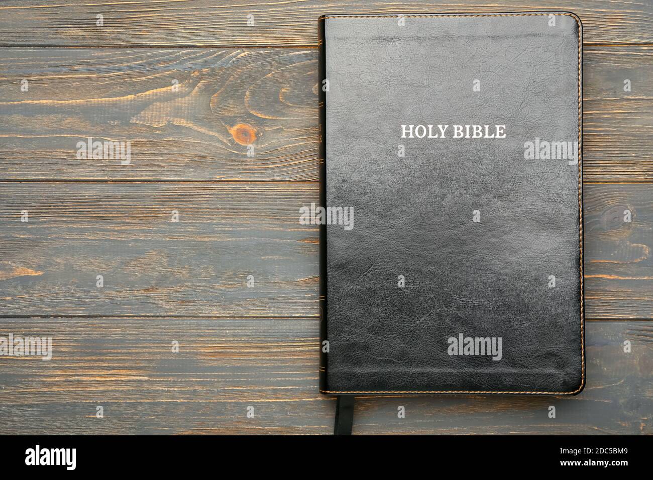 Holy Bible on wooden table Stock Photo - Alamy