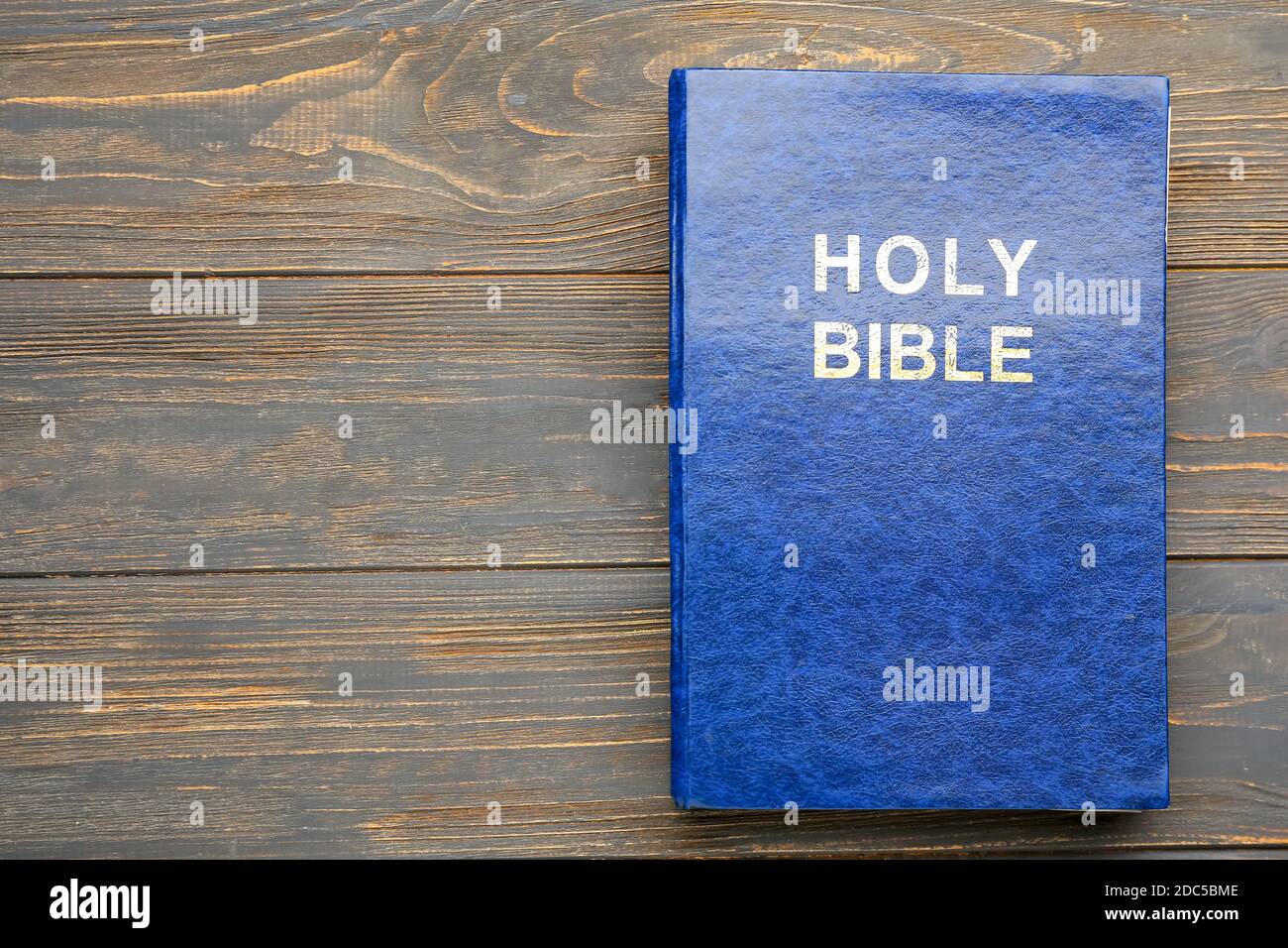 Holy Bible on wooden table Stock Photo - Alamy