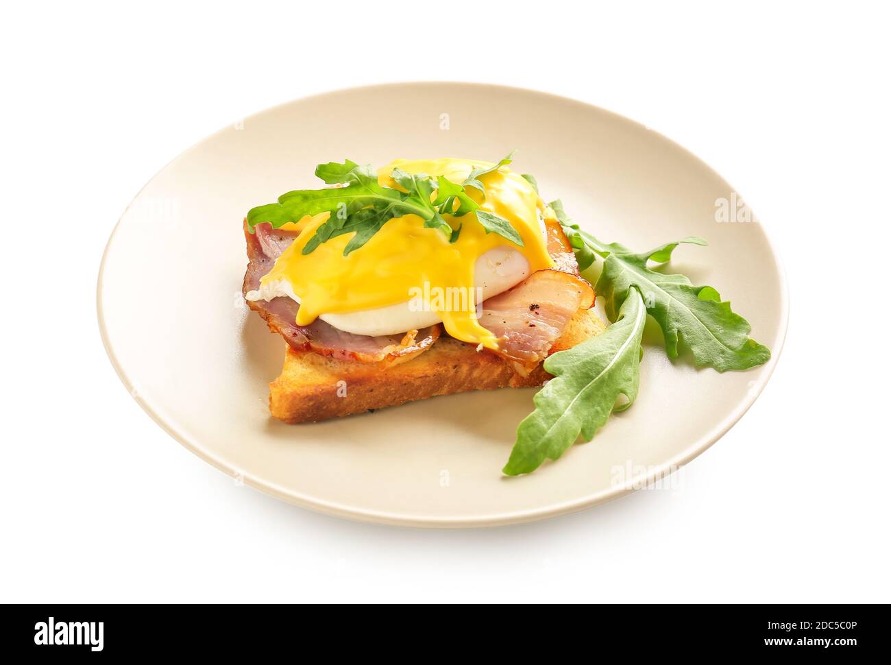 Plate with tasty egg Benedict on white background Stock Photo - Alamy