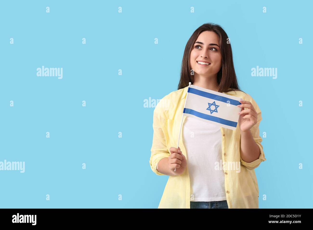Young woman with the flag of Israel on color background Stock Photo - Alamy