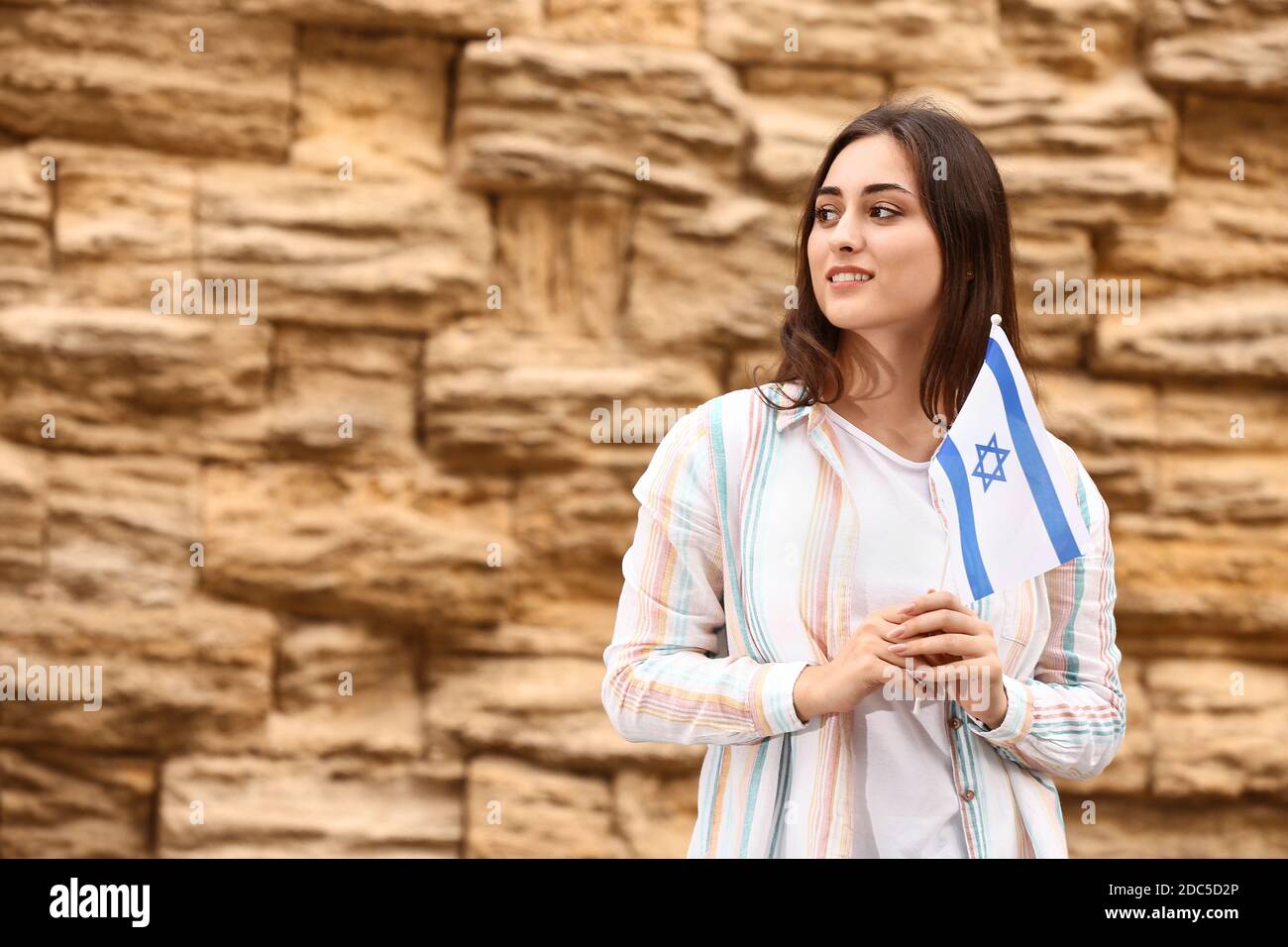Woman with the flag of Israel near the Wailing Wall Stock Photo - Alamy