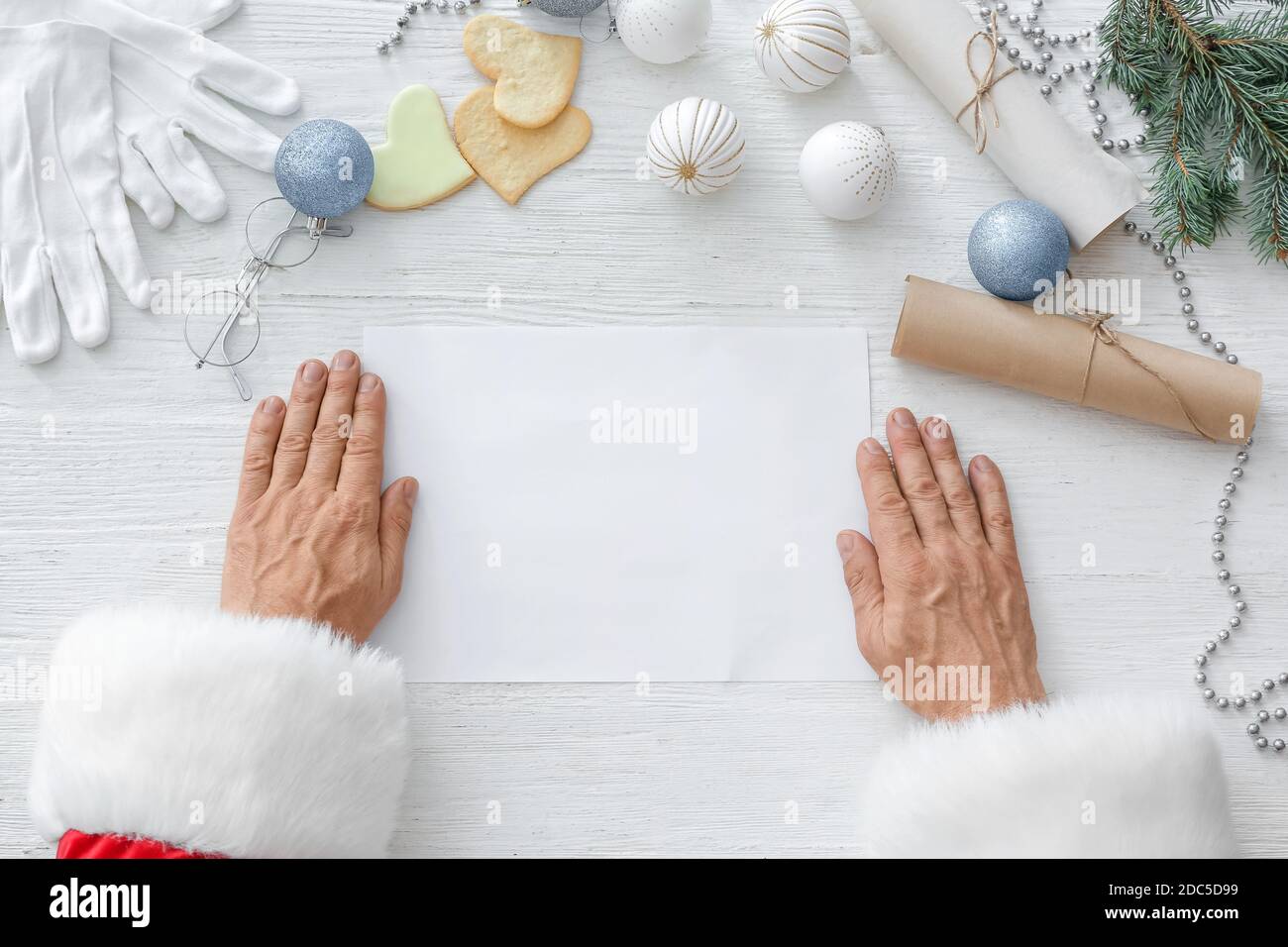 Santa Claus with empty letter at table Stock Photo - Alamy