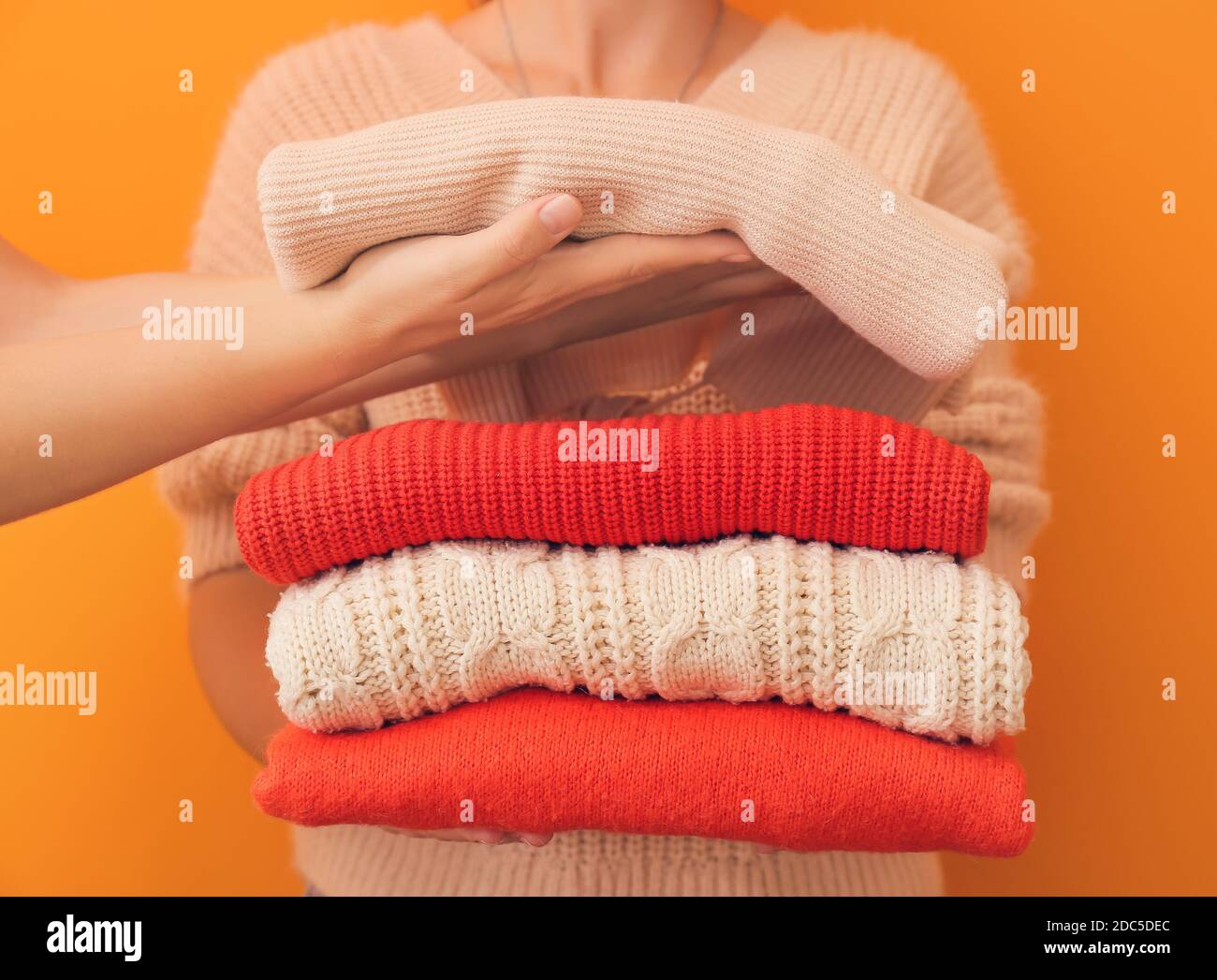 Women with warm clothes on color background, closeup Stock Photo - Alamy