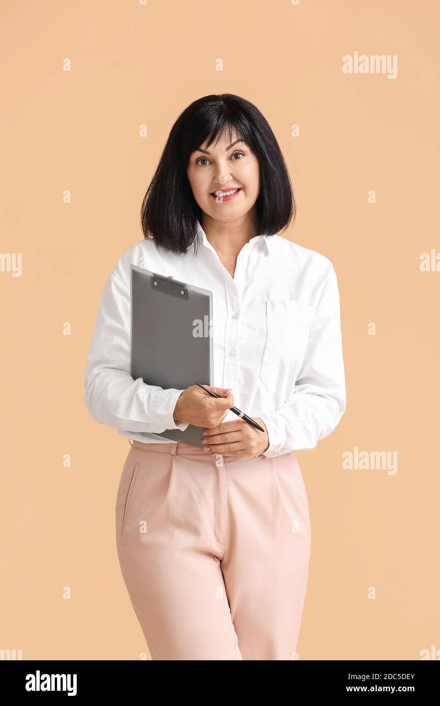 Portrait of female psychologist on color background Stock Photo - Alamy