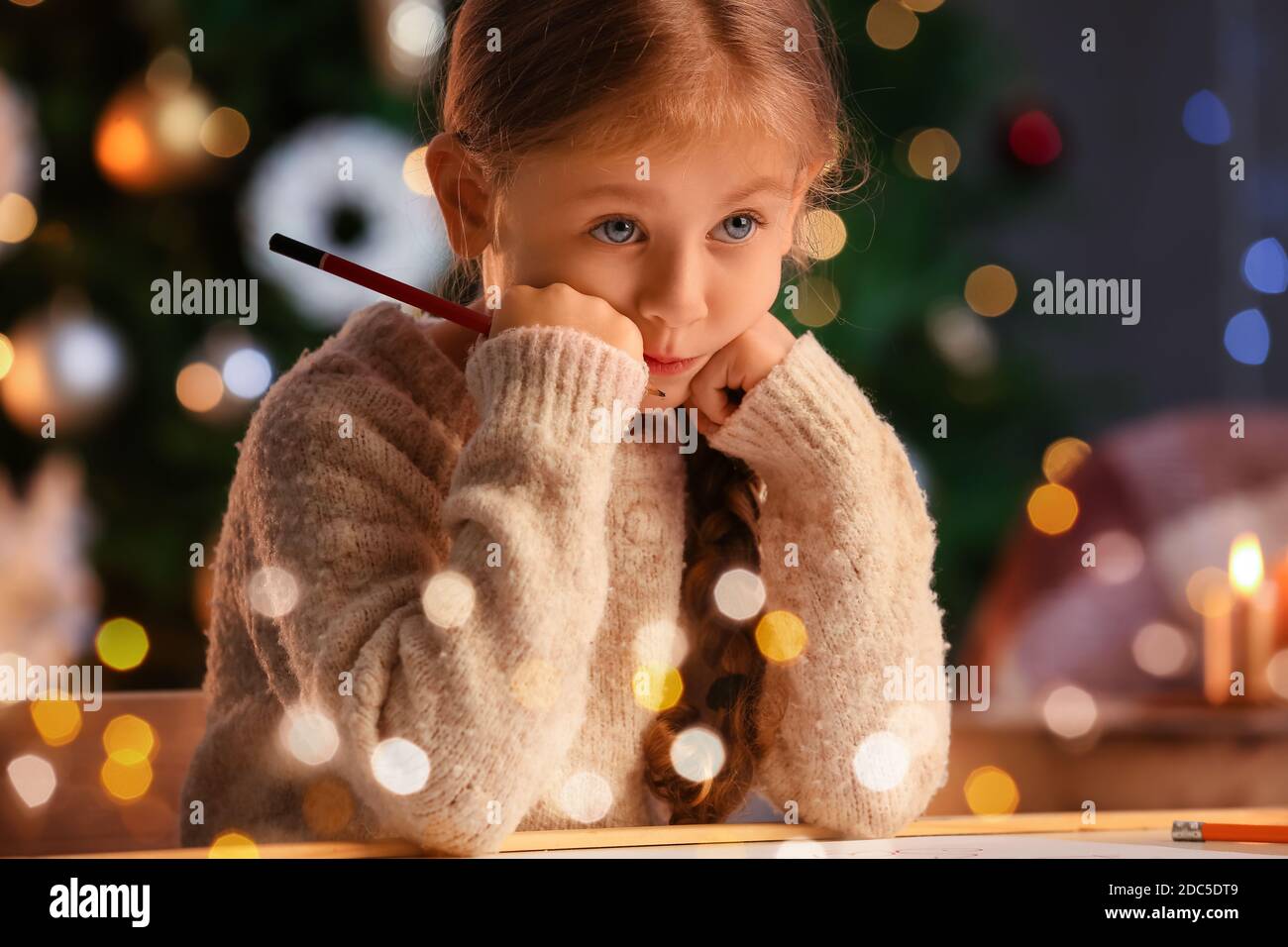 Cute little girl writing letter to Santa at home on Christmas eve Stock ...