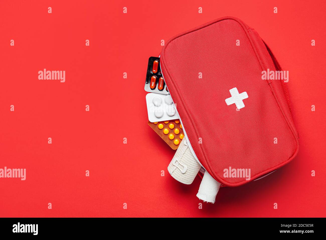 First aid kit on color background Stock Photo - Alamy