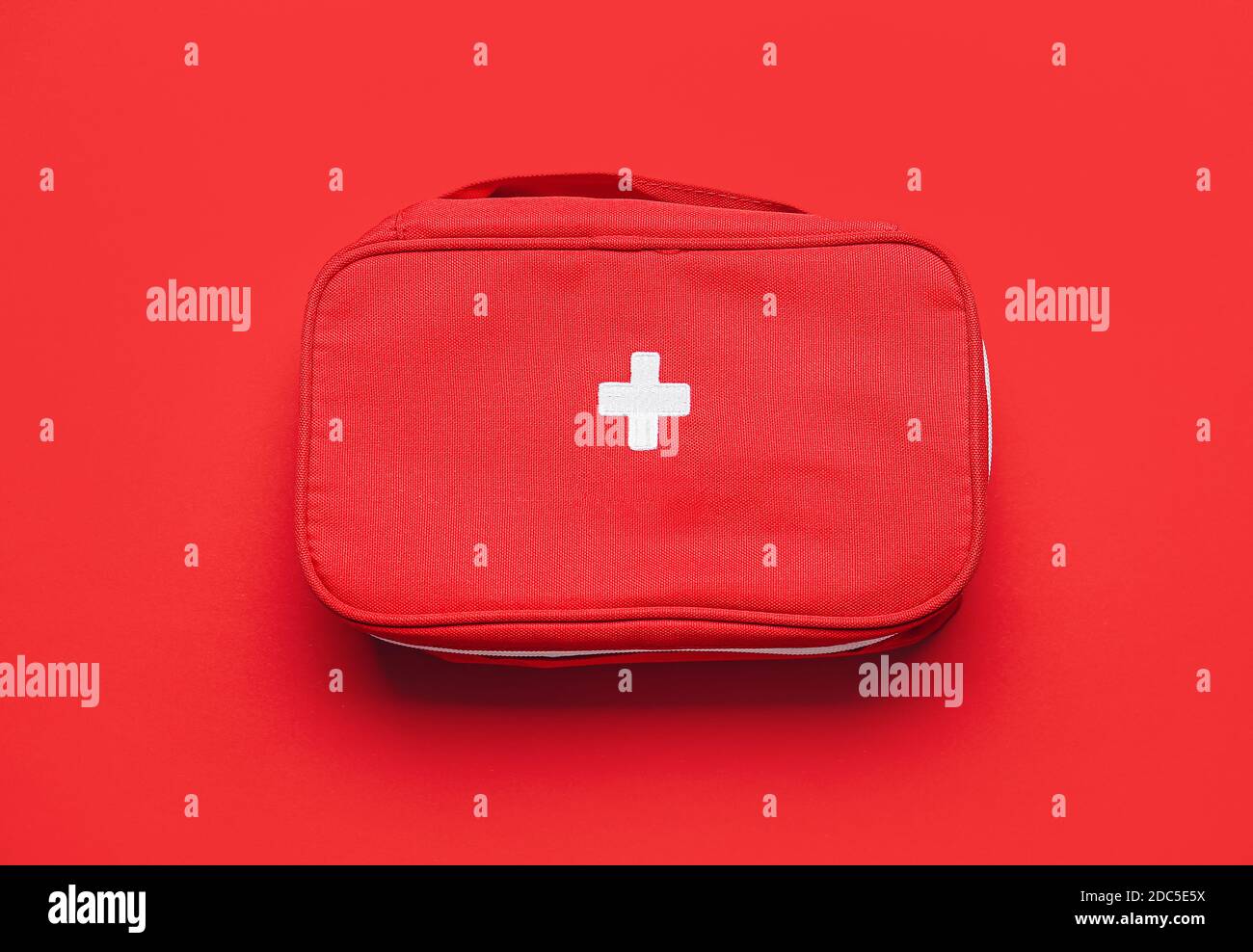 First aid kit on color background Stock Photo - Alamy