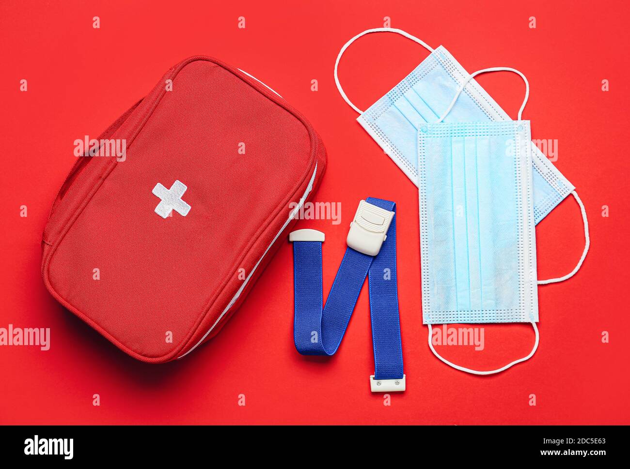 First aid kit on color background Stock Photo - Alamy