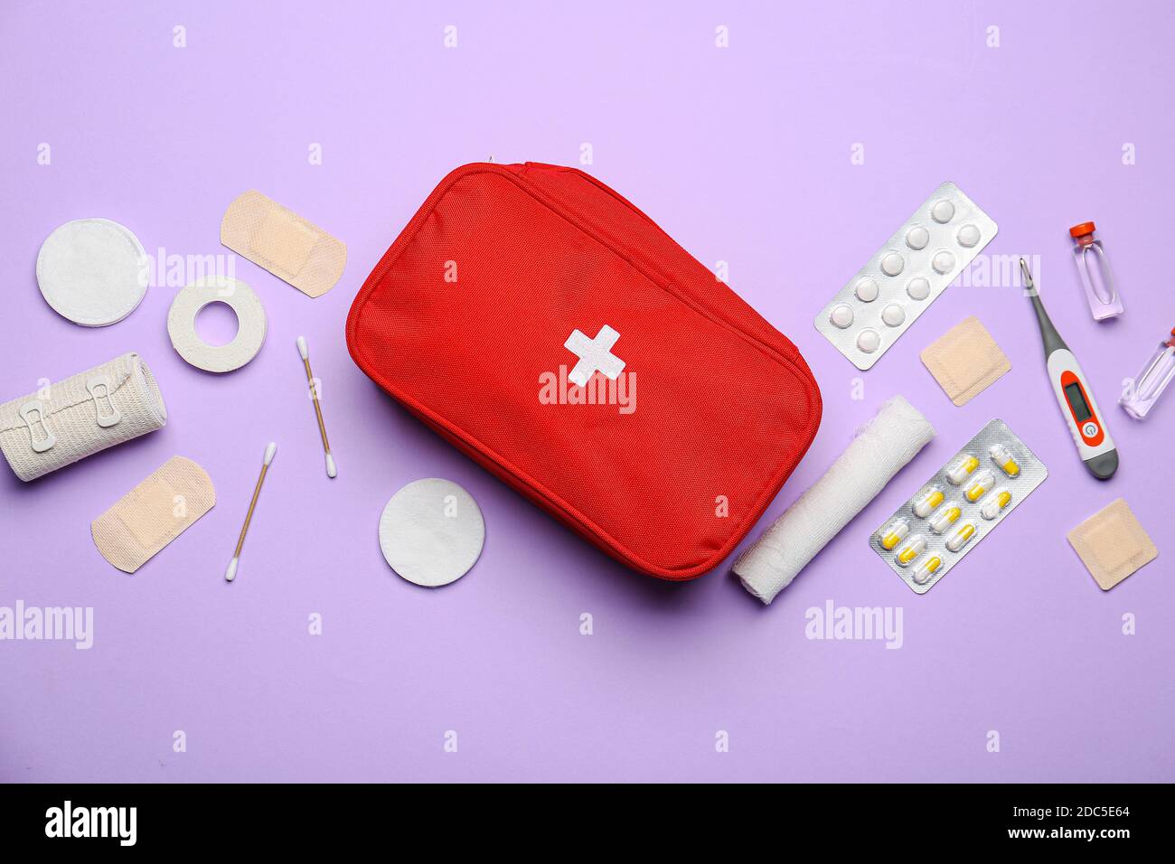 First aid kit on color background Stock Photo - Alamy