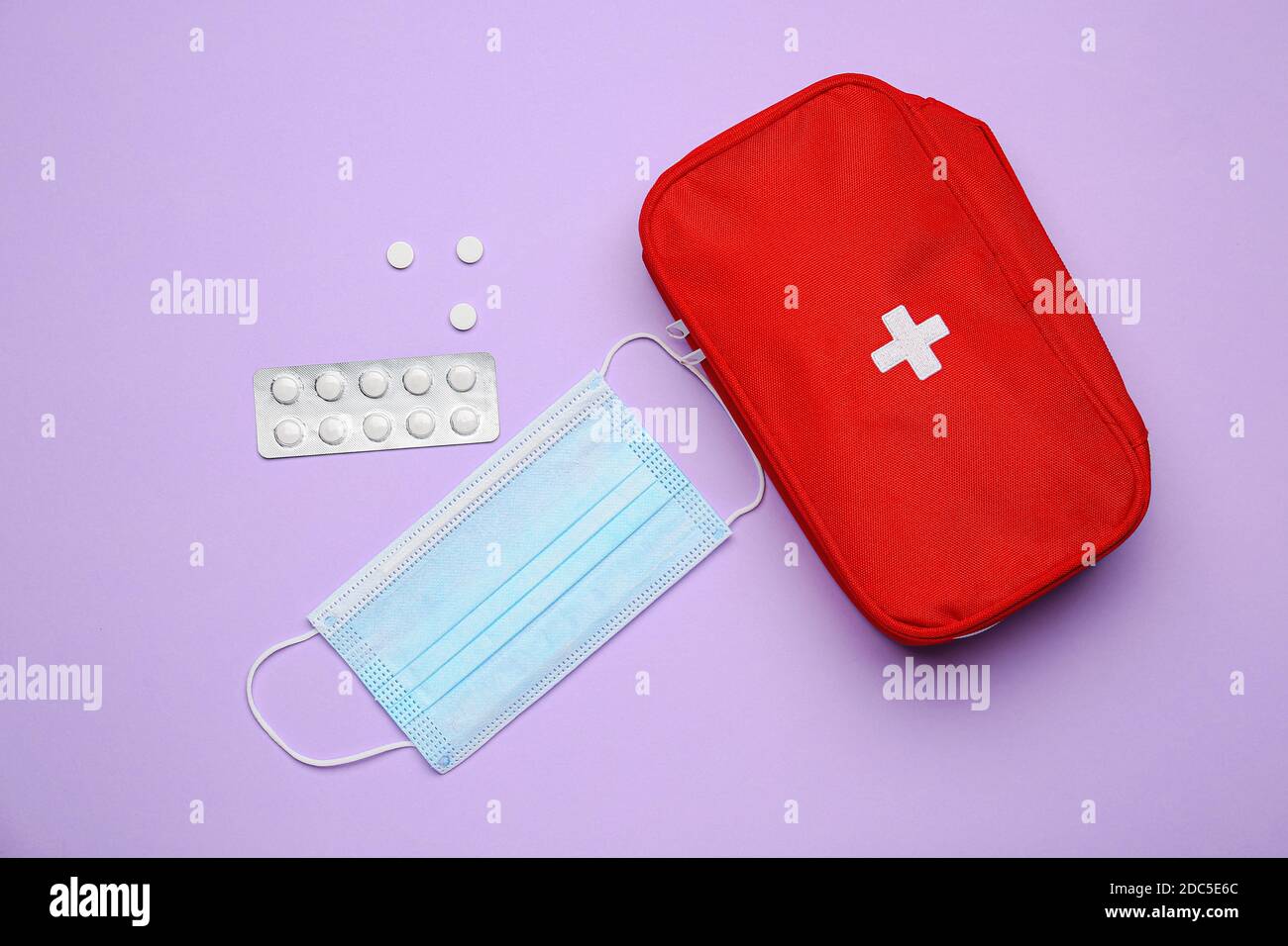 First aid kit on color background Stock Photo - Alamy