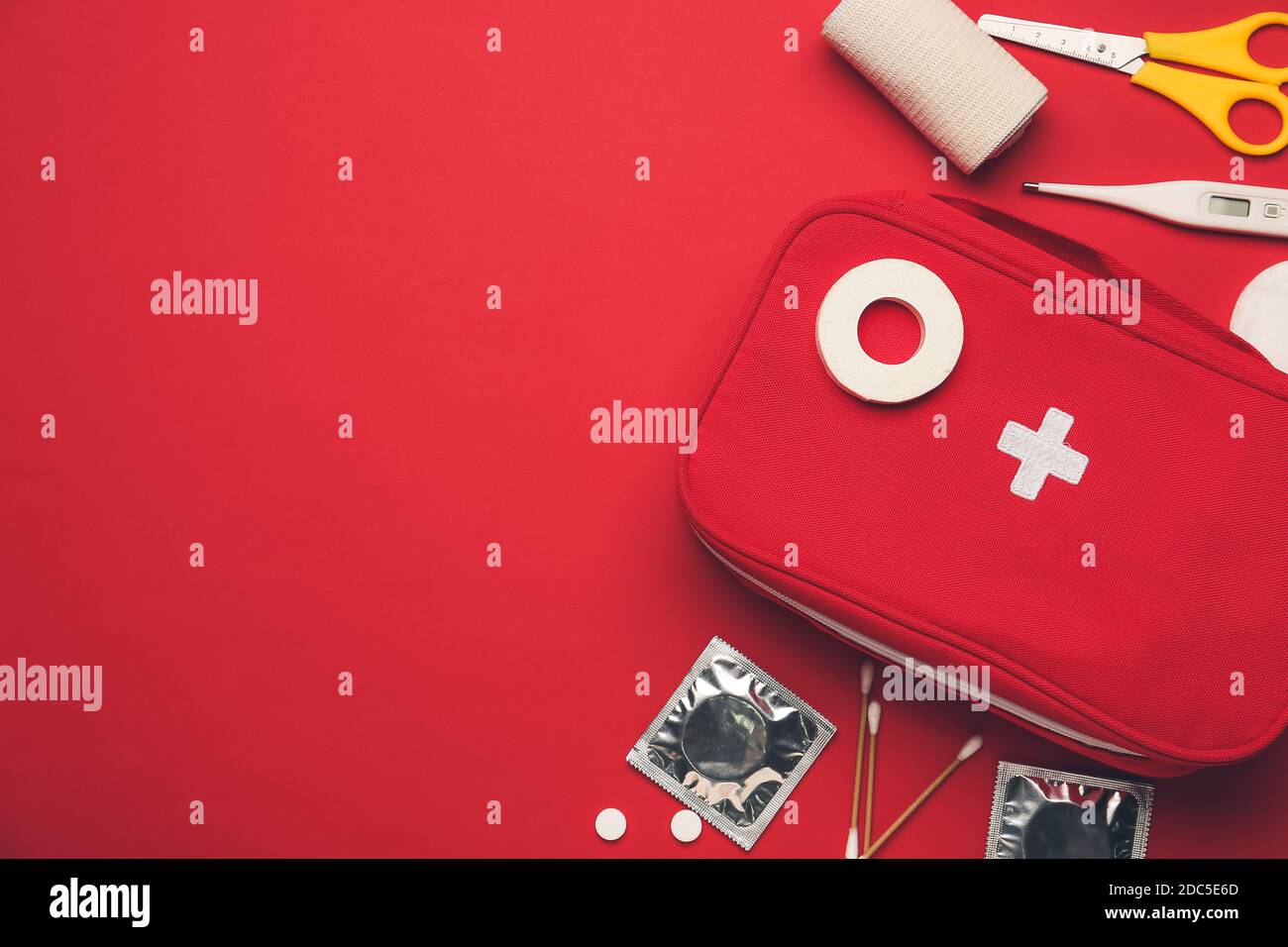 First aid kit on color background Stock Photo - Alamy