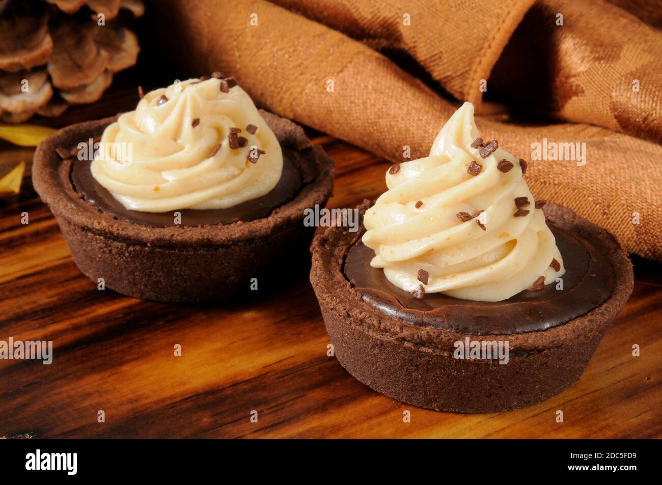 Chocolate cream dessert tarts on a holiday table Stock Photo - Alamy
