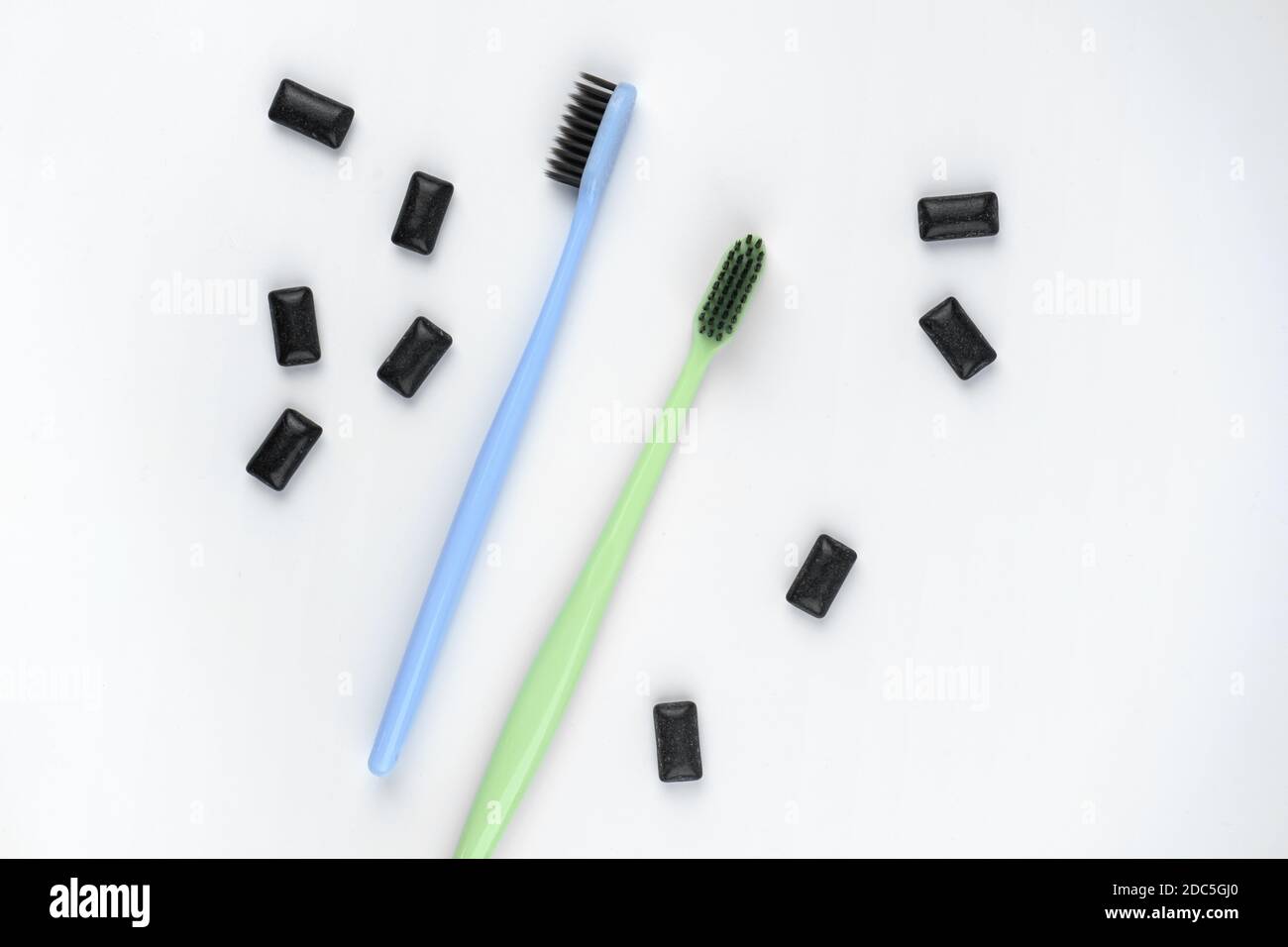 Image of black gum pads with toothbrushes on white background Stock ...