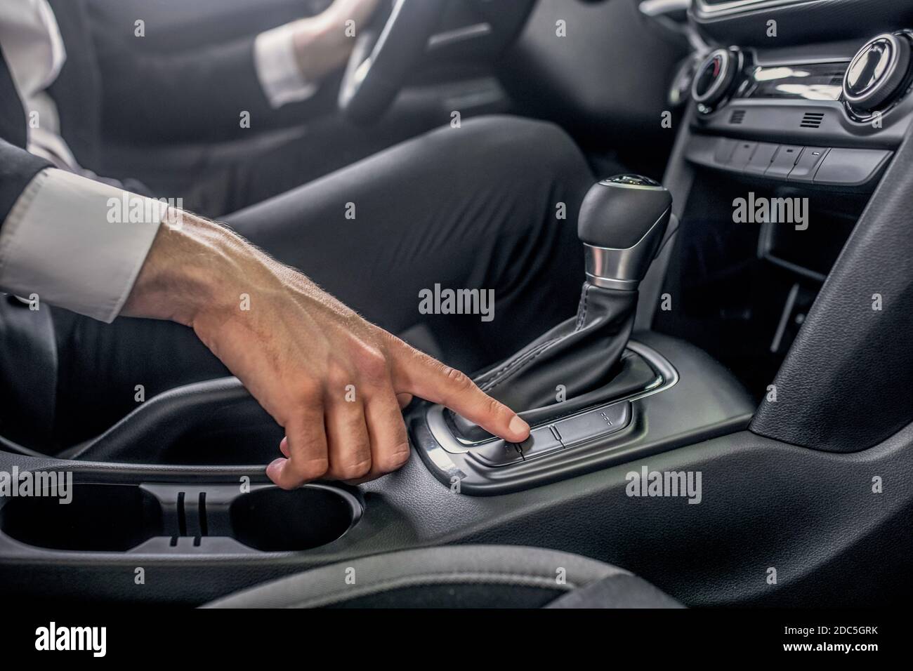 Close-up of male hand adjusting gear unit settings Stock Photo - Alamy