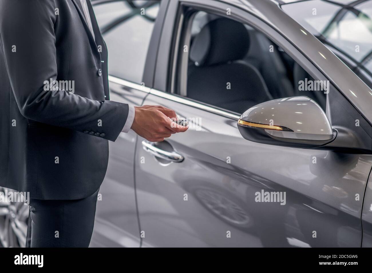Close-up of male hand pressing car alarm button Stock Photo - Alamy