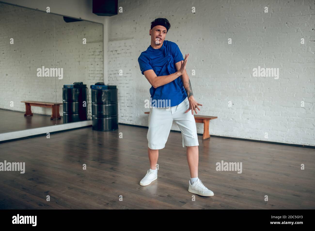 Energetic man making dance movements in the class Stock Photo - Alamy