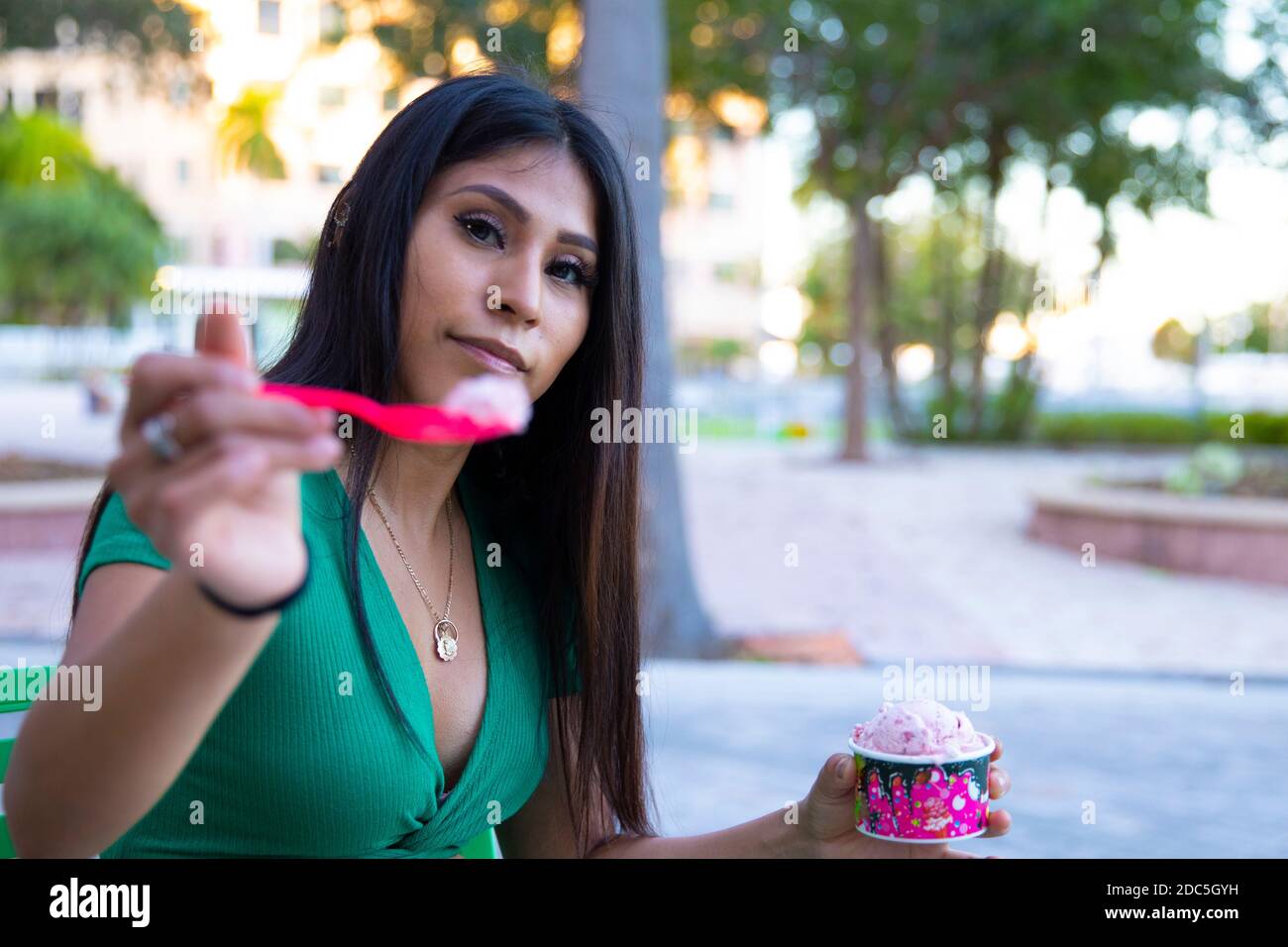 young woman feeding her boyfriend ice cream Stock Photo - Alamy