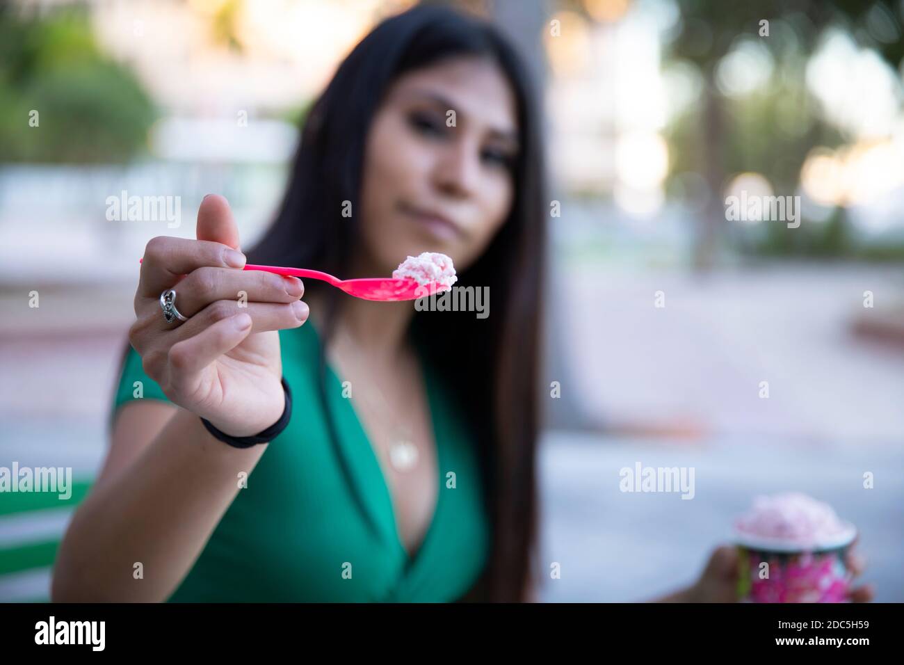 young woman feeding her boyfriend ice cream Stock Photo - Alamy
