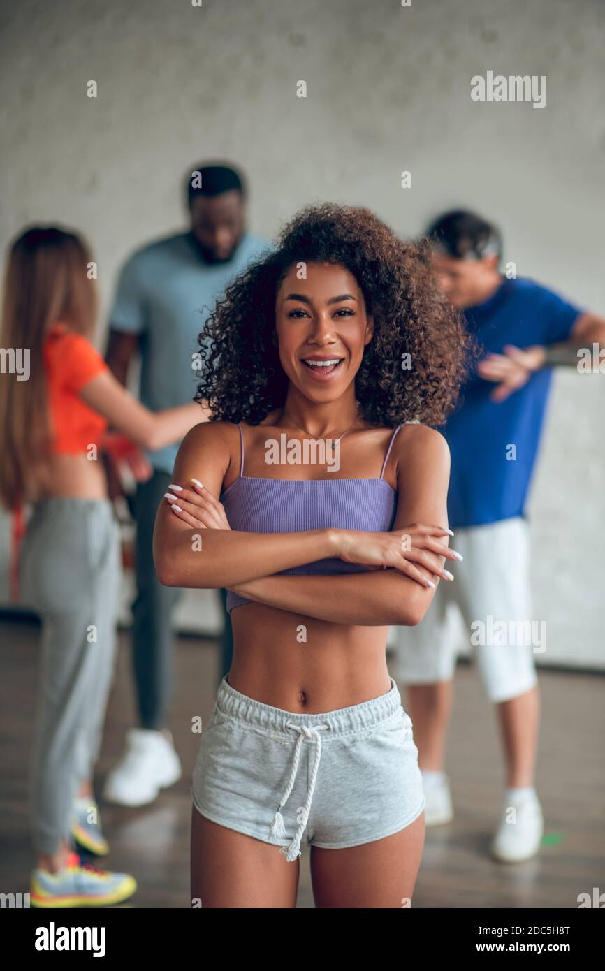 Confident and professional woman leading a dancers team Stock Photo - Alamy