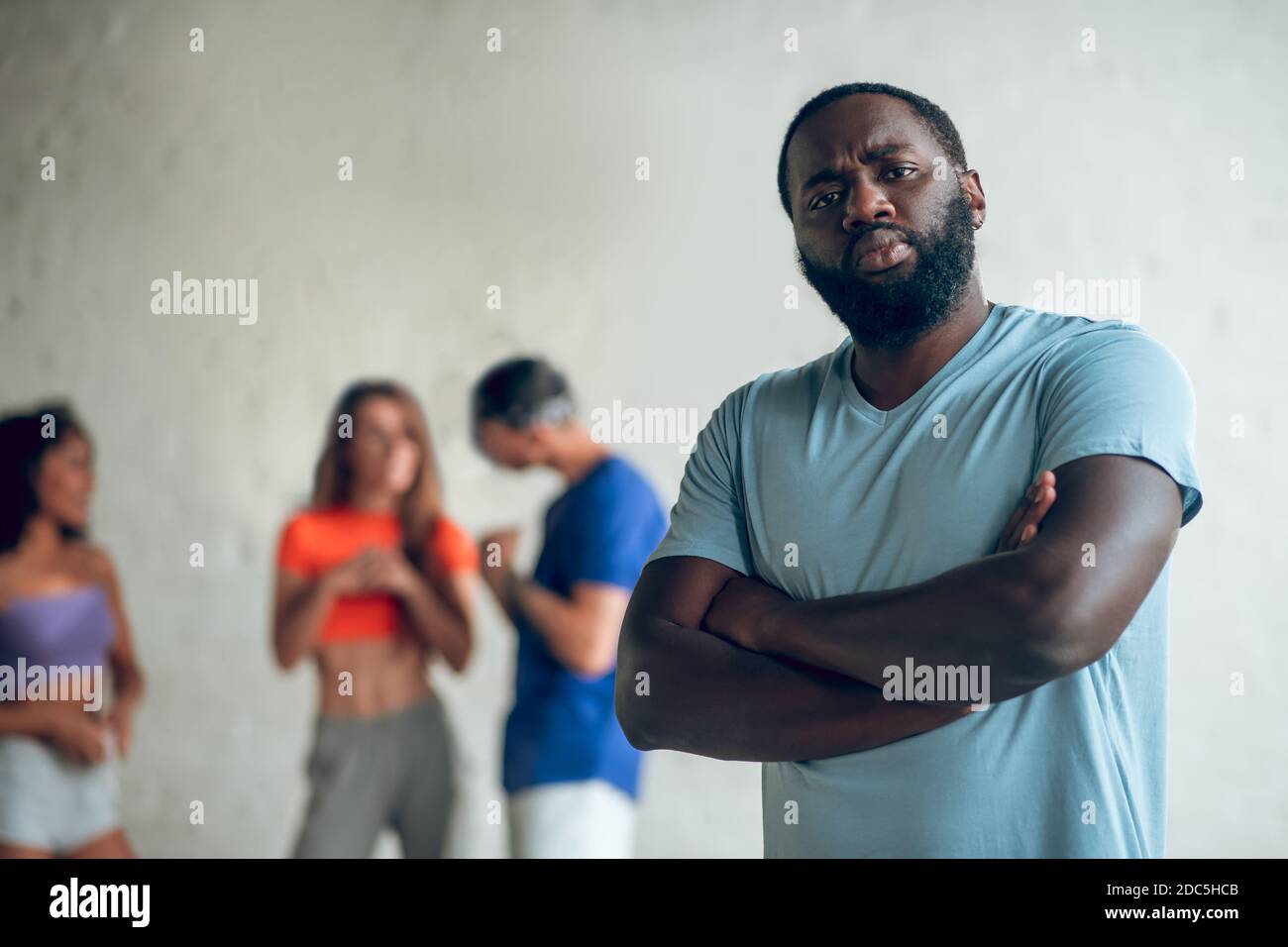 Confident man leading the group of his colleagues Stock Photo - Alamy