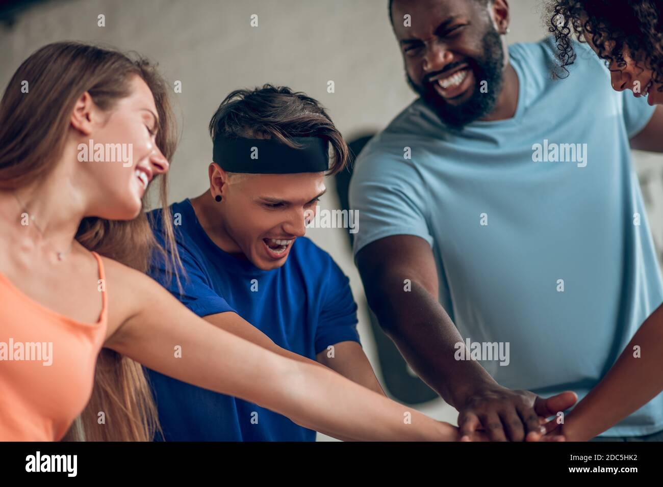 Group of colleagues improving their team work Stock Photo - Alamy