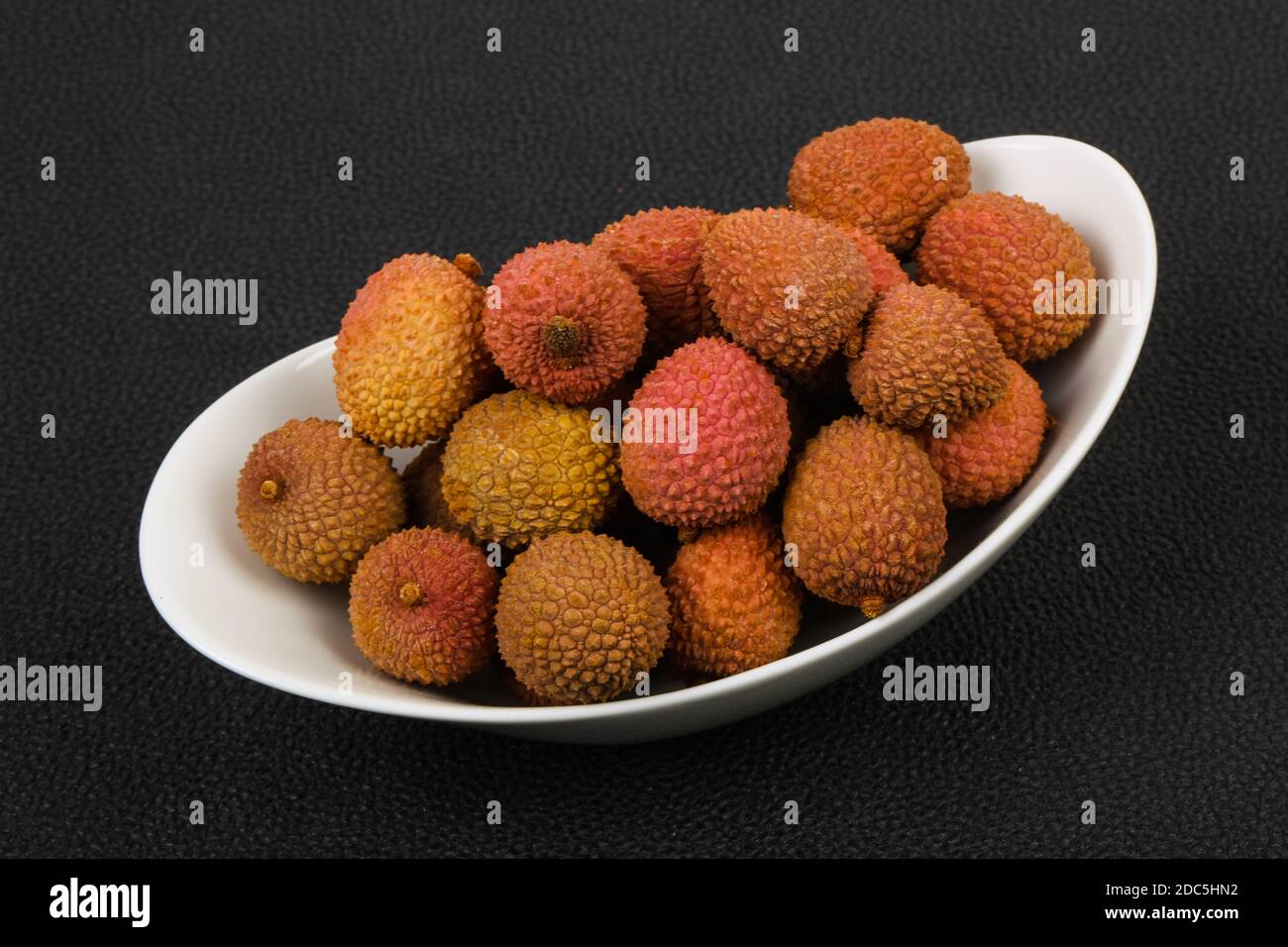 Tropical fruit lychee in the bowl Stock Photo - Alamy