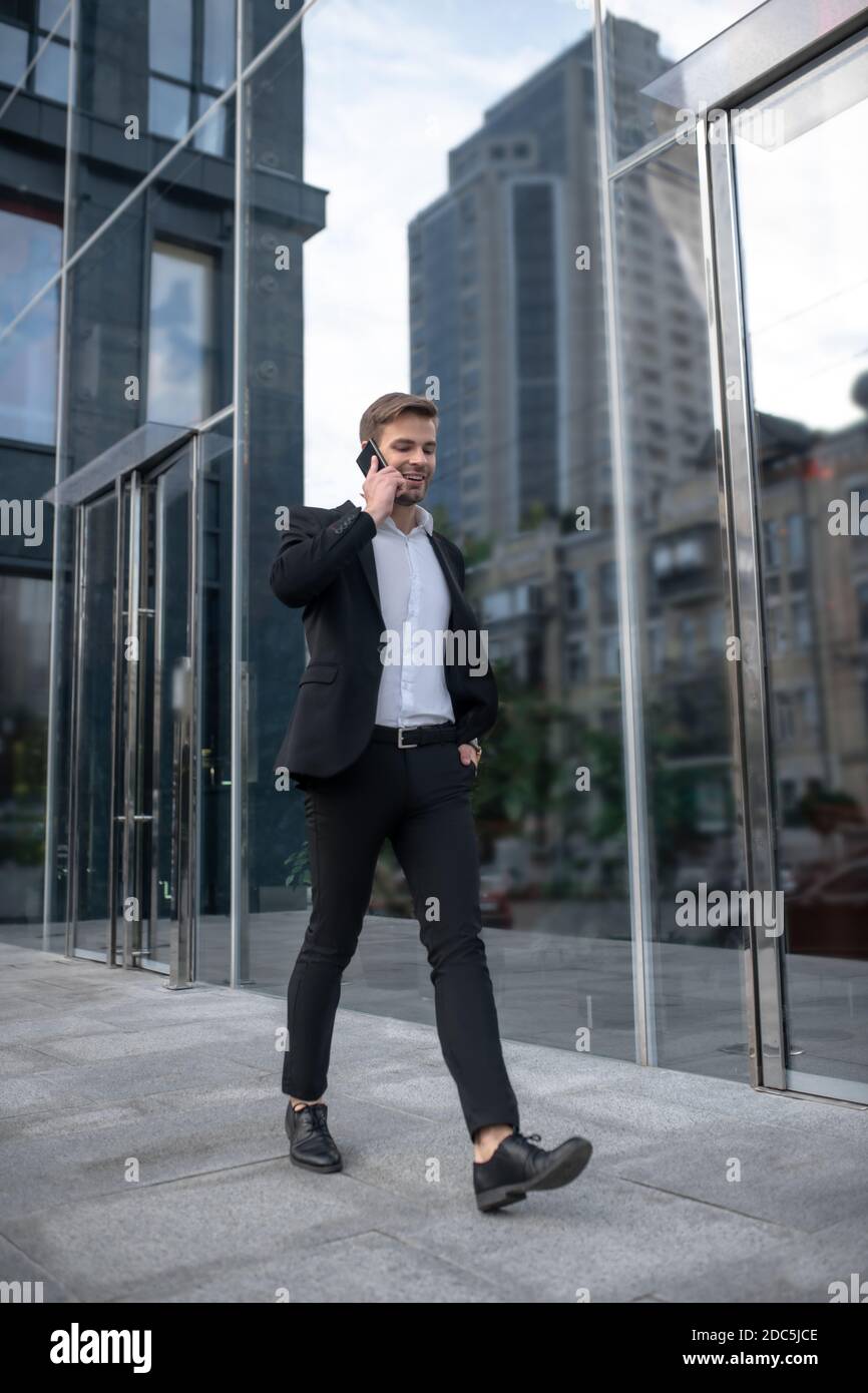 Stylish caucasian man walking outdoors hi-res stock photography and ...