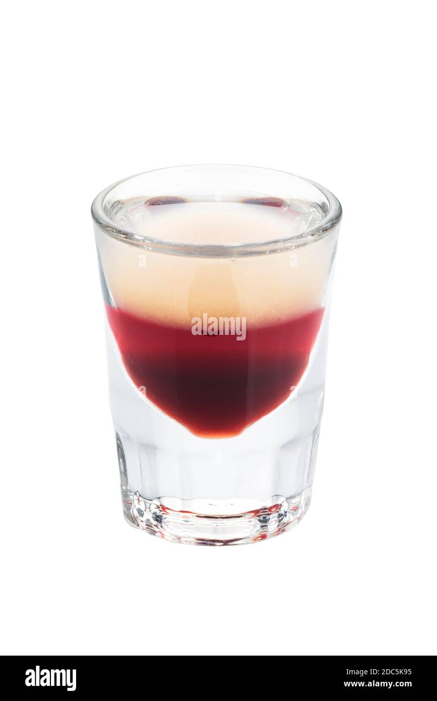 Alcohol shots cocktail in a glass isolated on white background. Layered ...