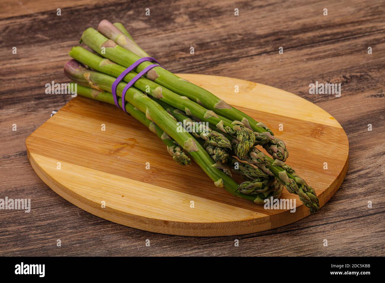 Vegan cuisine - Raw asparagus heap for cooking Stock Photo - Alamy