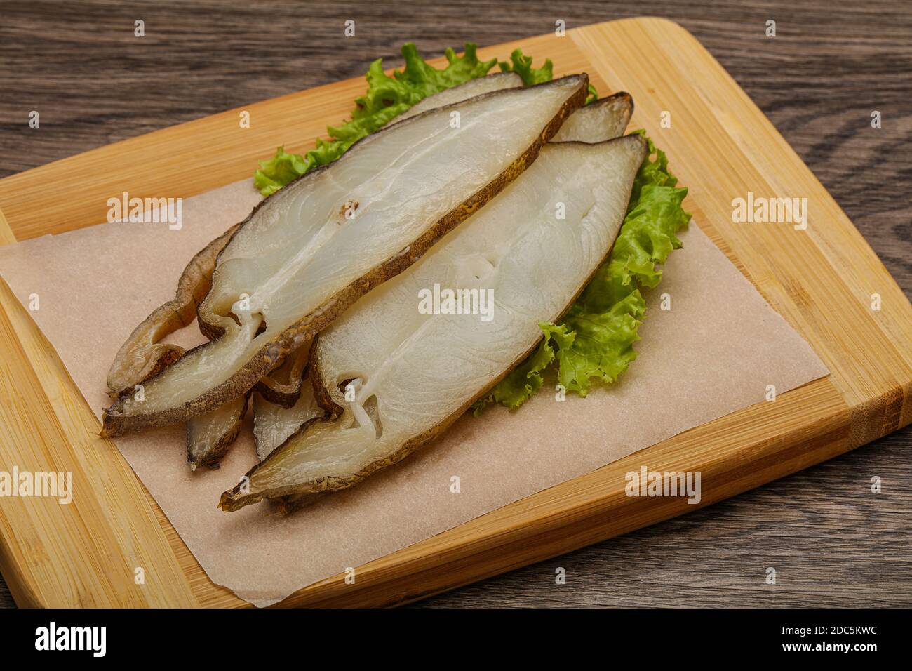 Delicous smoked halibut fish slices snack Stock Photo - Alamy