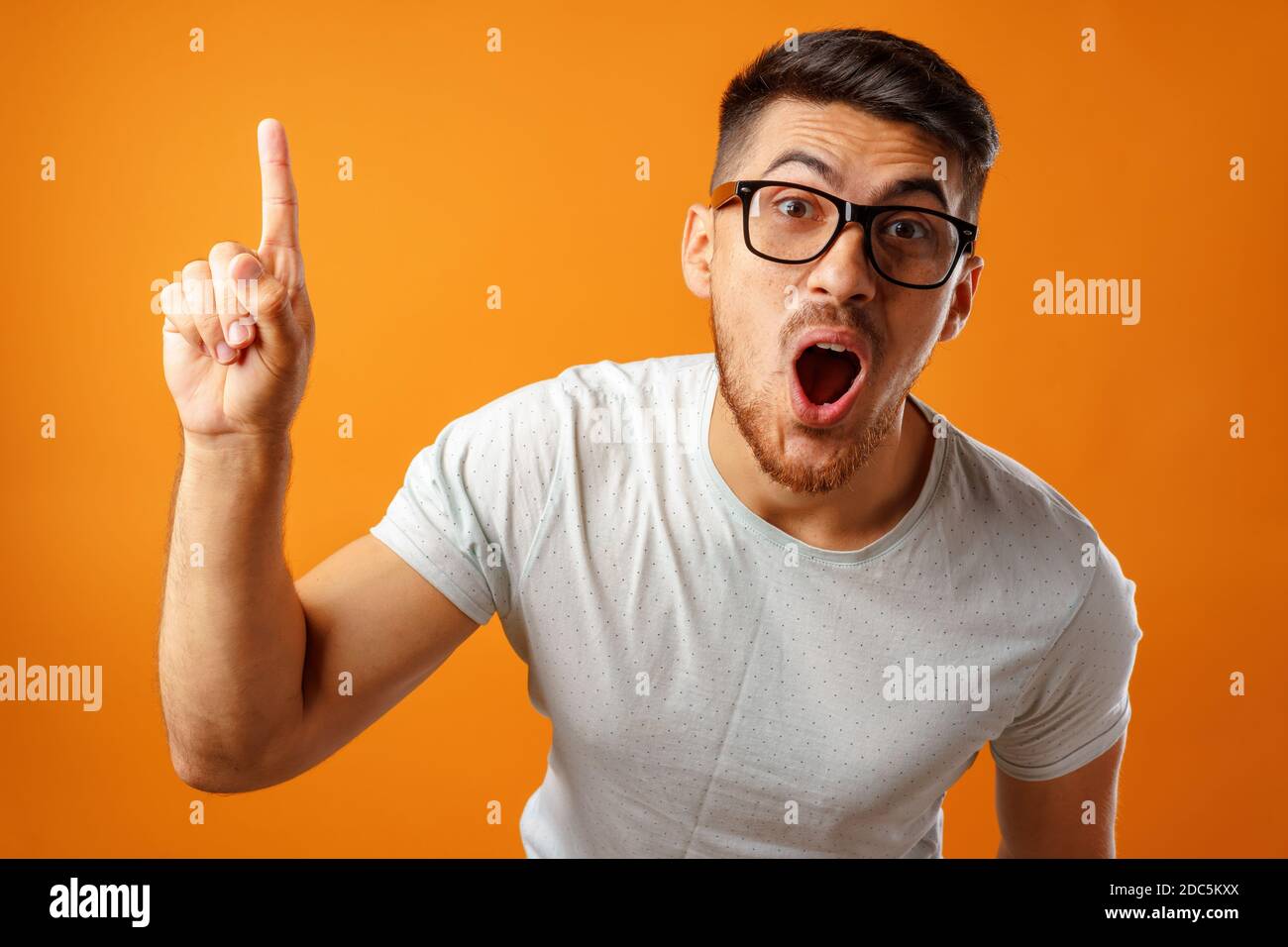 Young man putting his finger up hi-res stock photography and images - Alamy